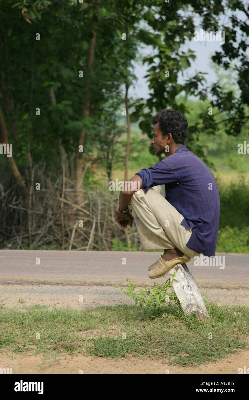 Man sitting in the asian way, India Stock Photo - Alamy