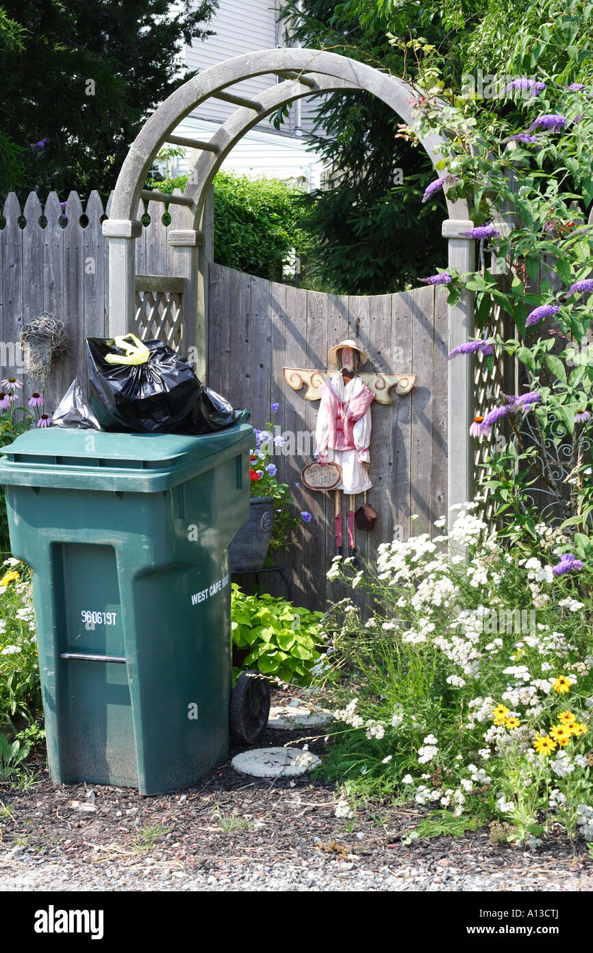 Man and garbage face off Stock Photo - Alamy