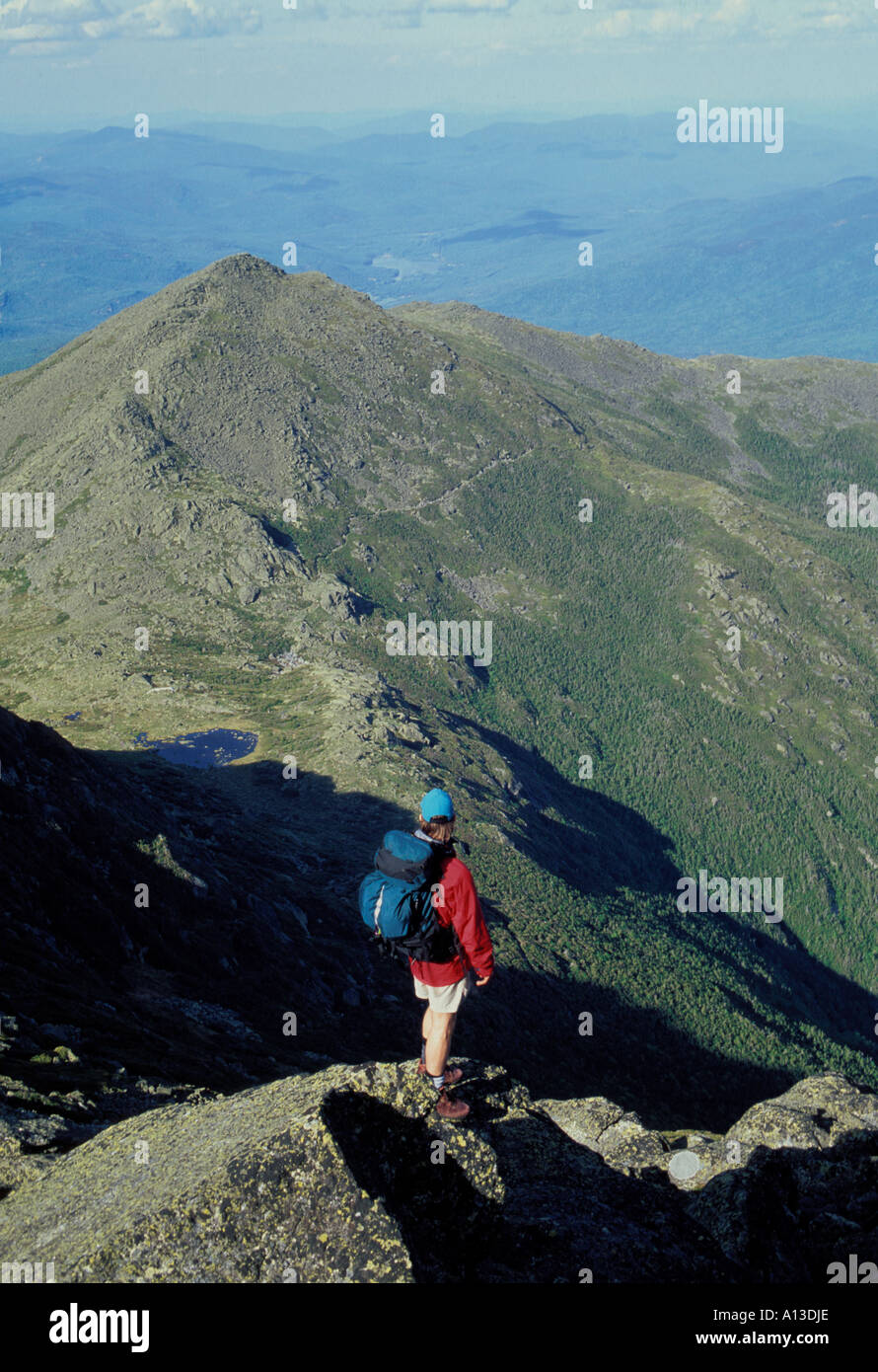 A hiker looks to Mt Madison from Mt Adams the second highest peak in NH ...