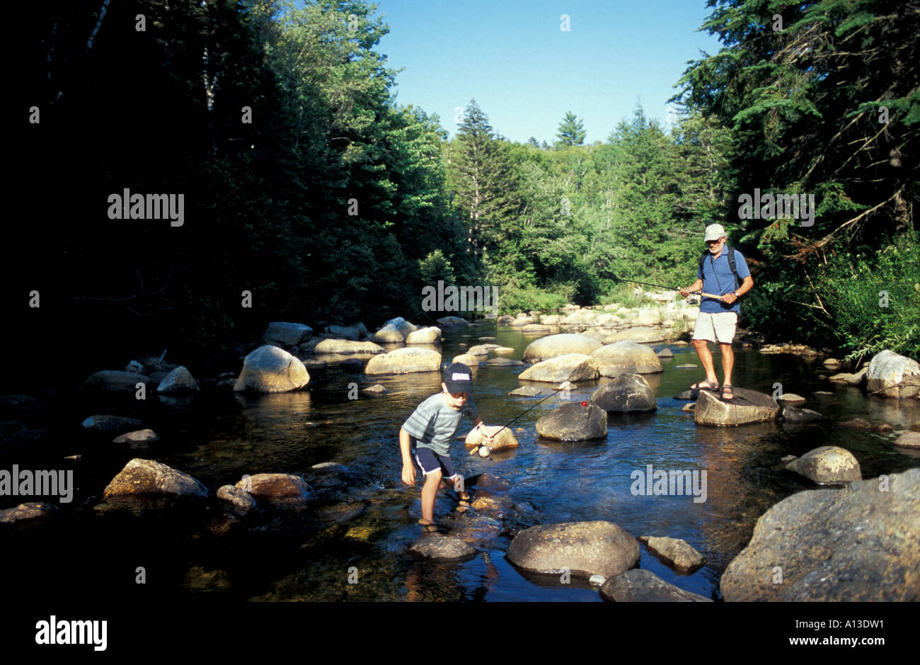 A young boy and his grandfather try their luck at fishing on the Moose ...