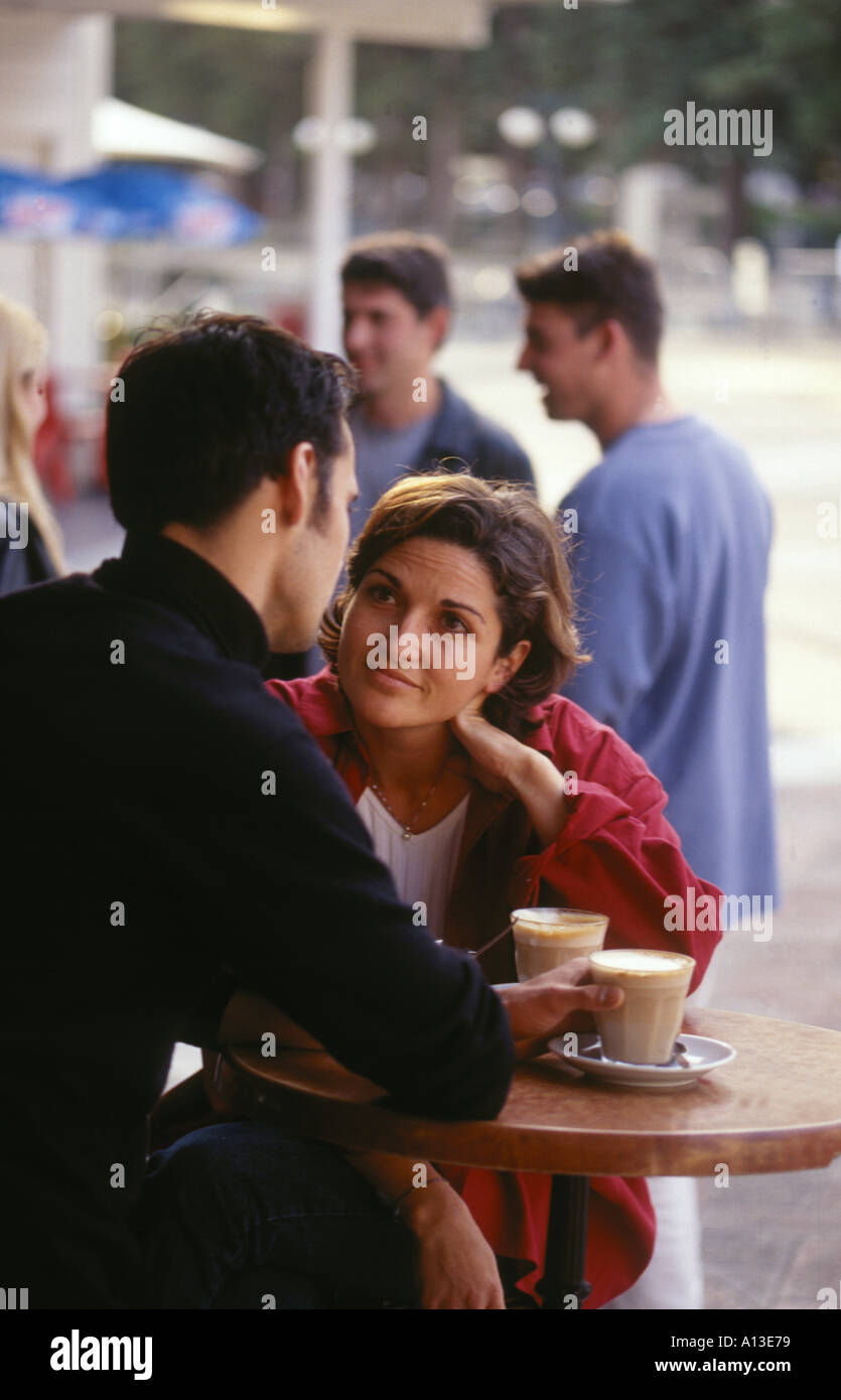 Young couple talk over coffee Stock Photo - Alamy