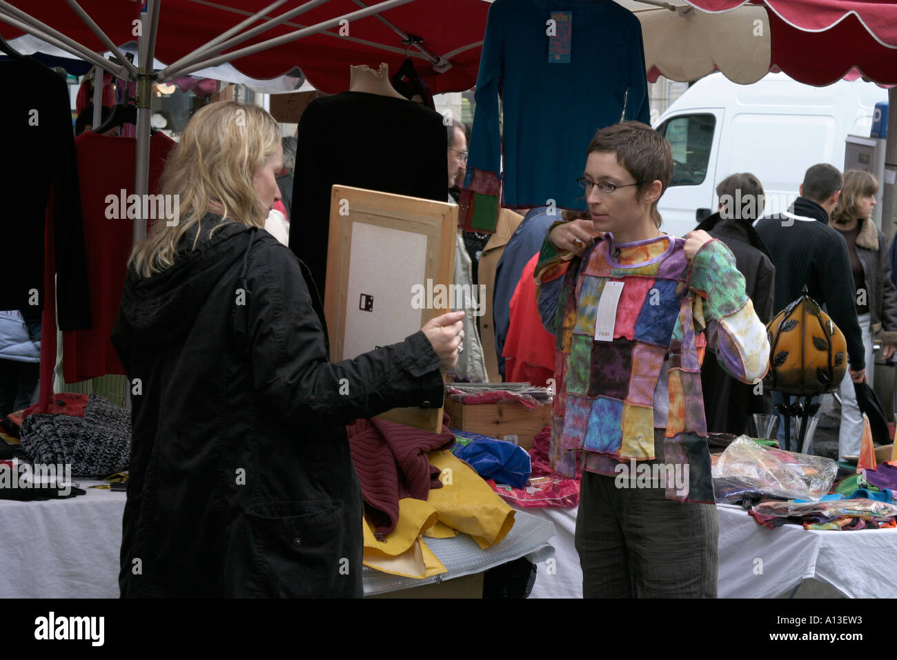 Women at clothing stall in Vannes market France Stock Photo - Alamy