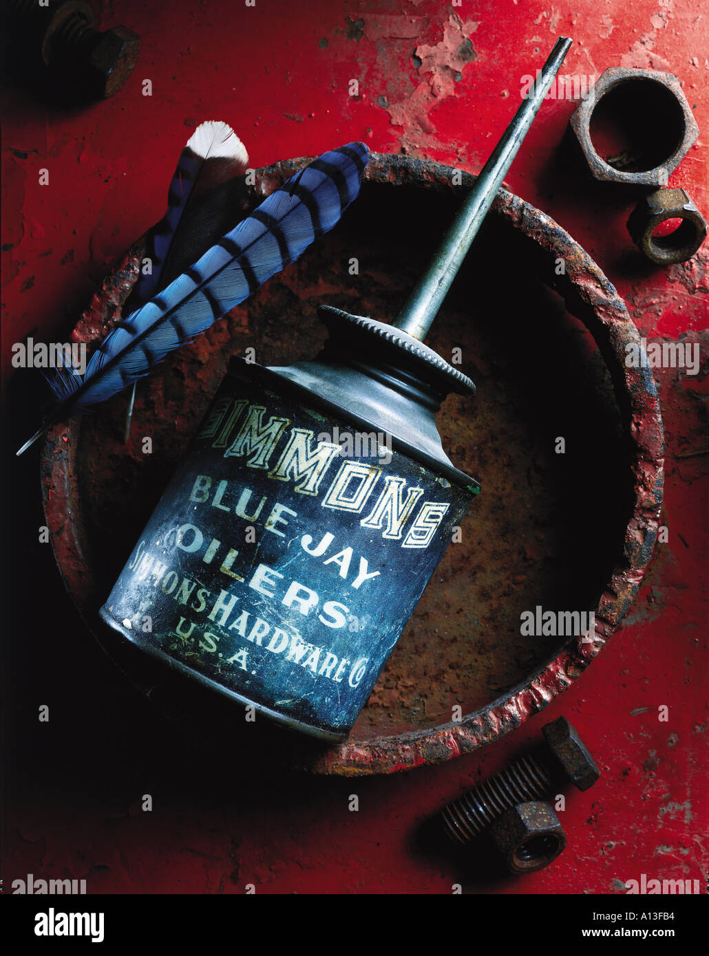 still life of antique oil can on red metal Stock Photo - Alamy