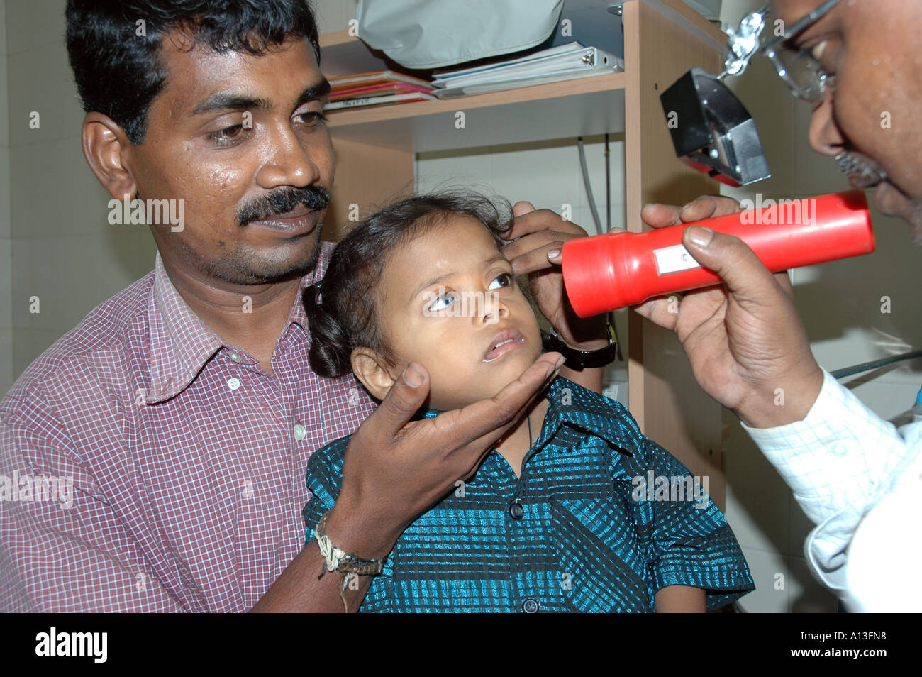 A young boy having a check up after successful cataract surgery in ...