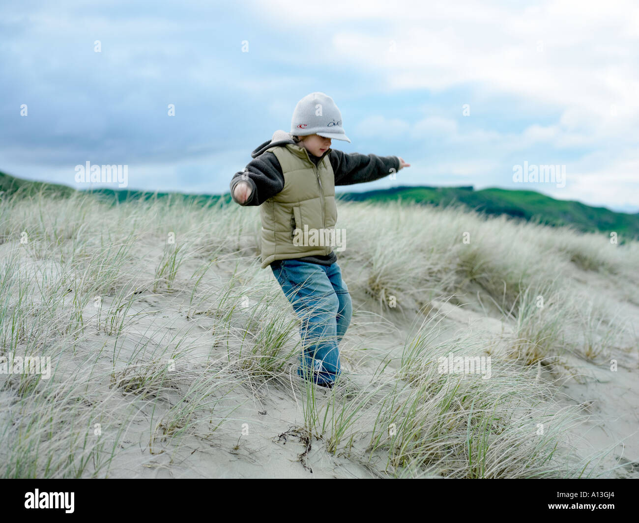 Family running down sand dunes hi-res stock photography and images - Alamy