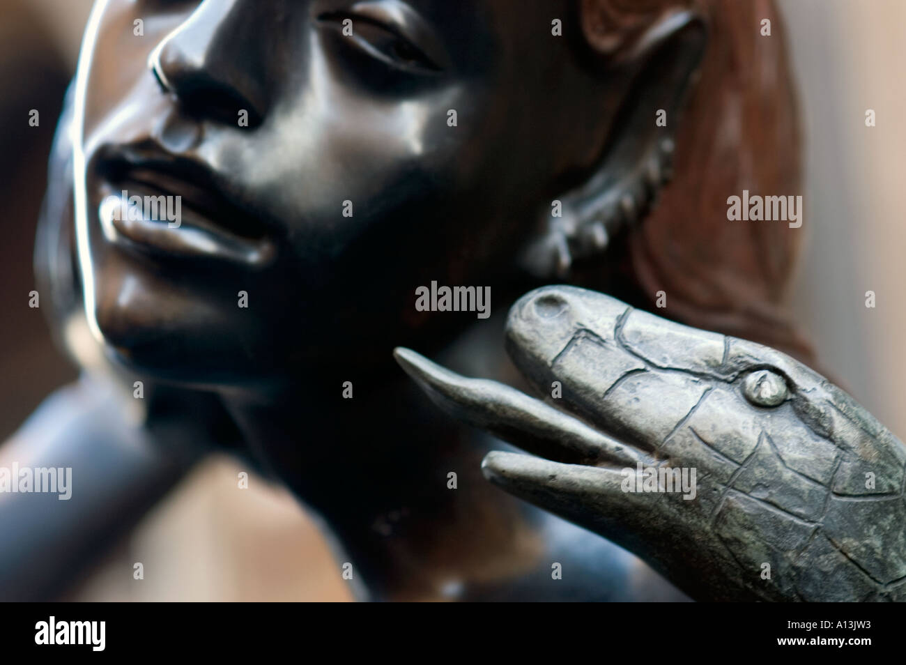 female and snake sculpture temptation, rome, italy Stock Photo - Alamy