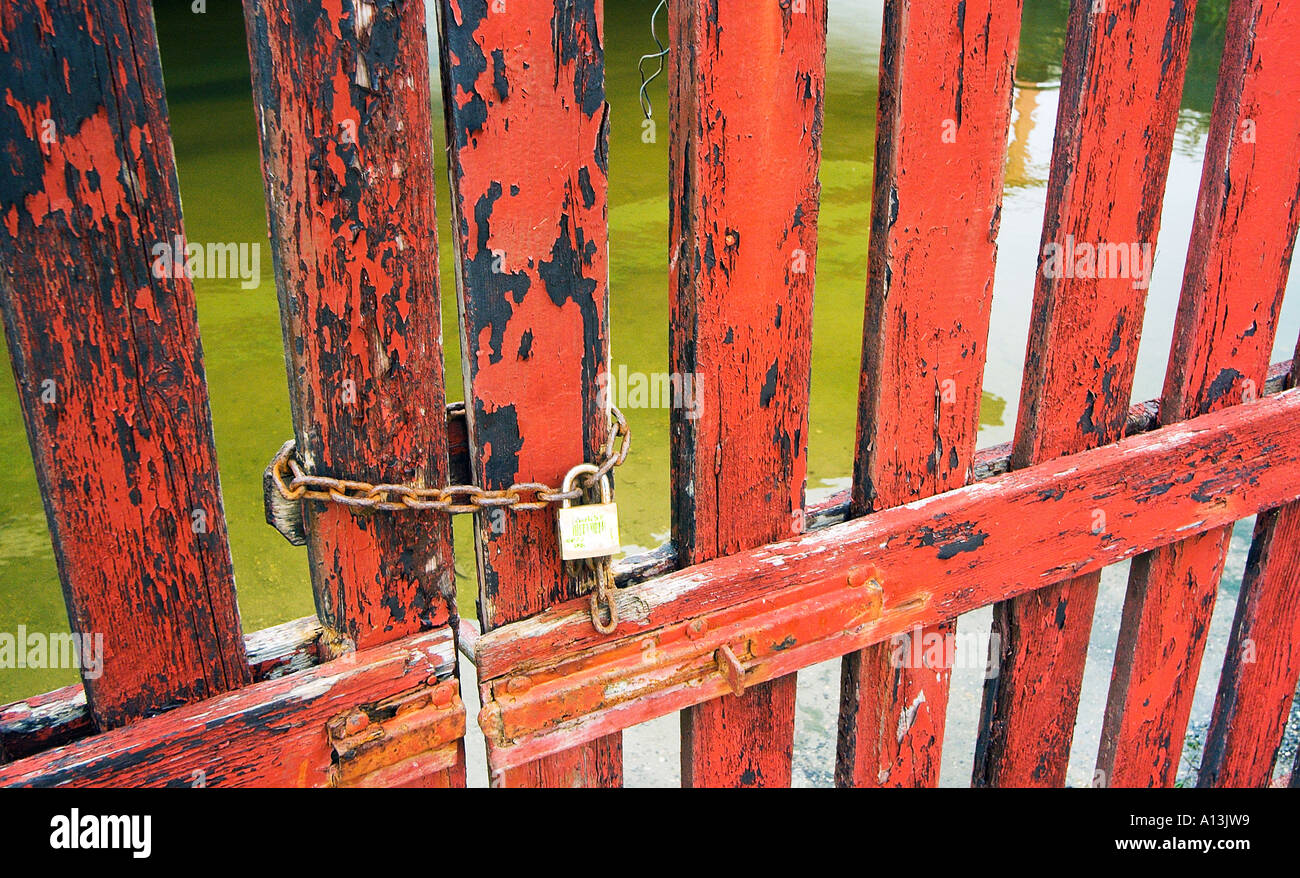 red wooden gate locked Stock Photo - Alamy