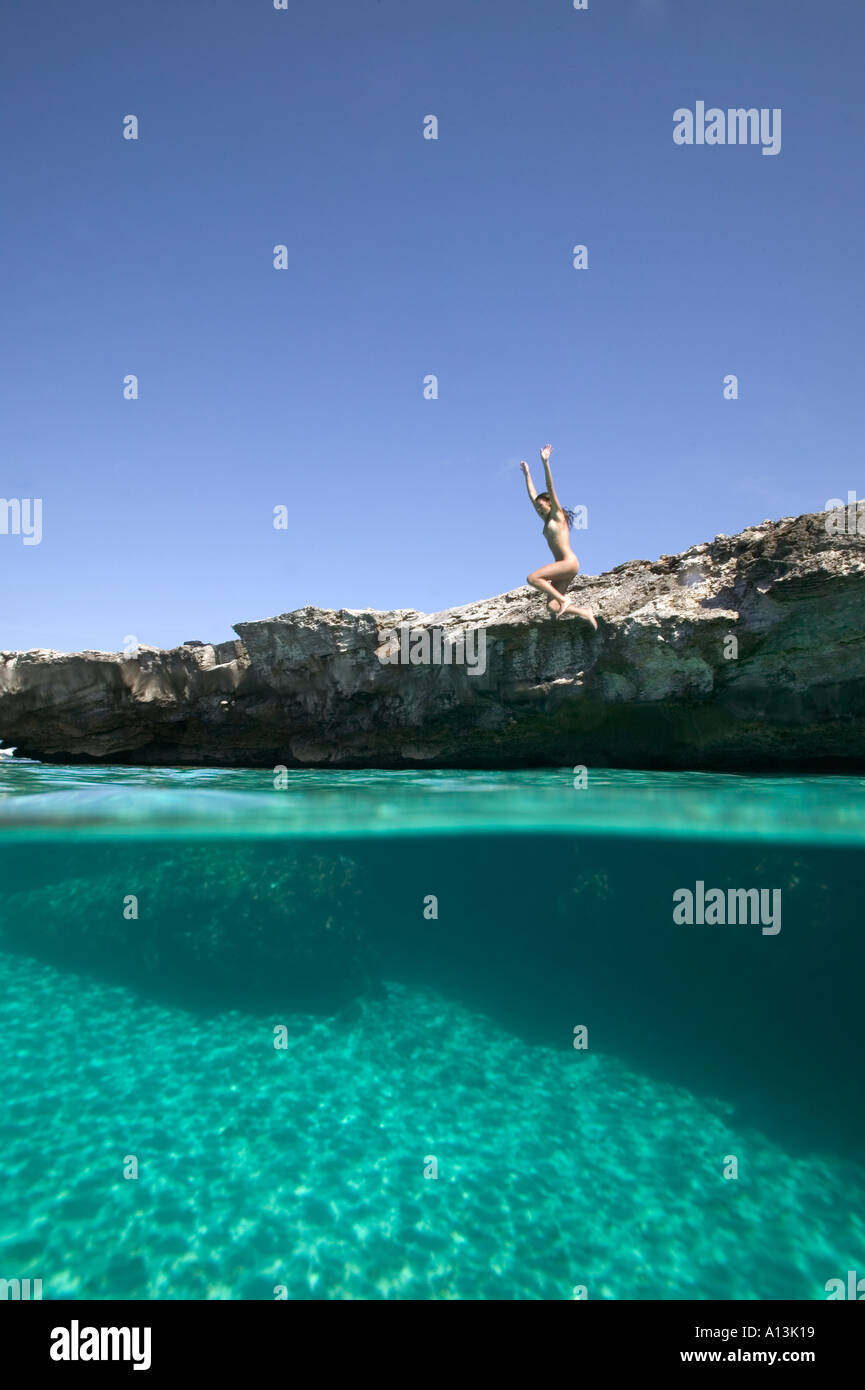 Woman jumping into Swimming Hole Cay Sal Bank Bahamas Islands Stock ...