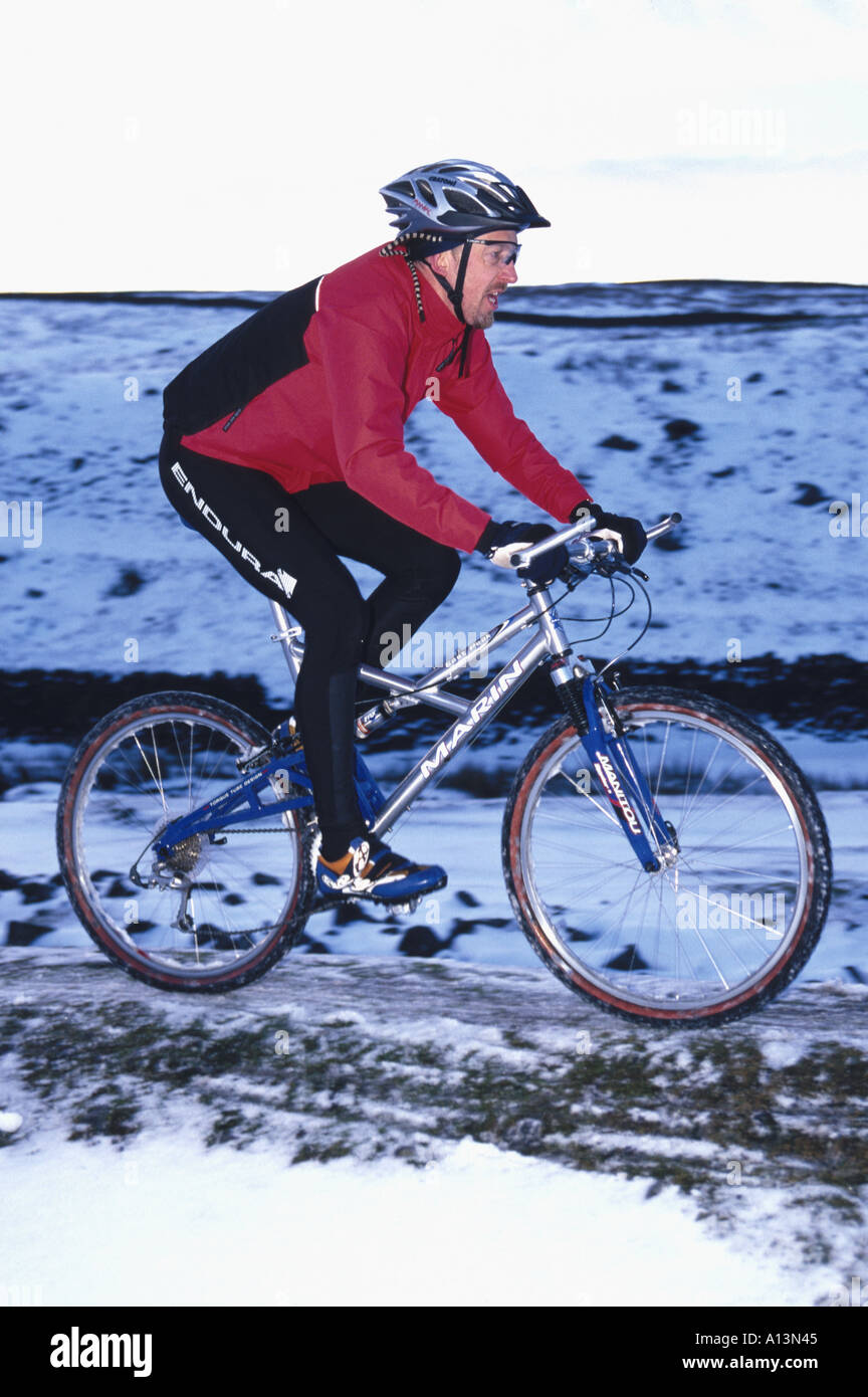 Snowy track bike biker biking cycling hi-res stock photography and ...