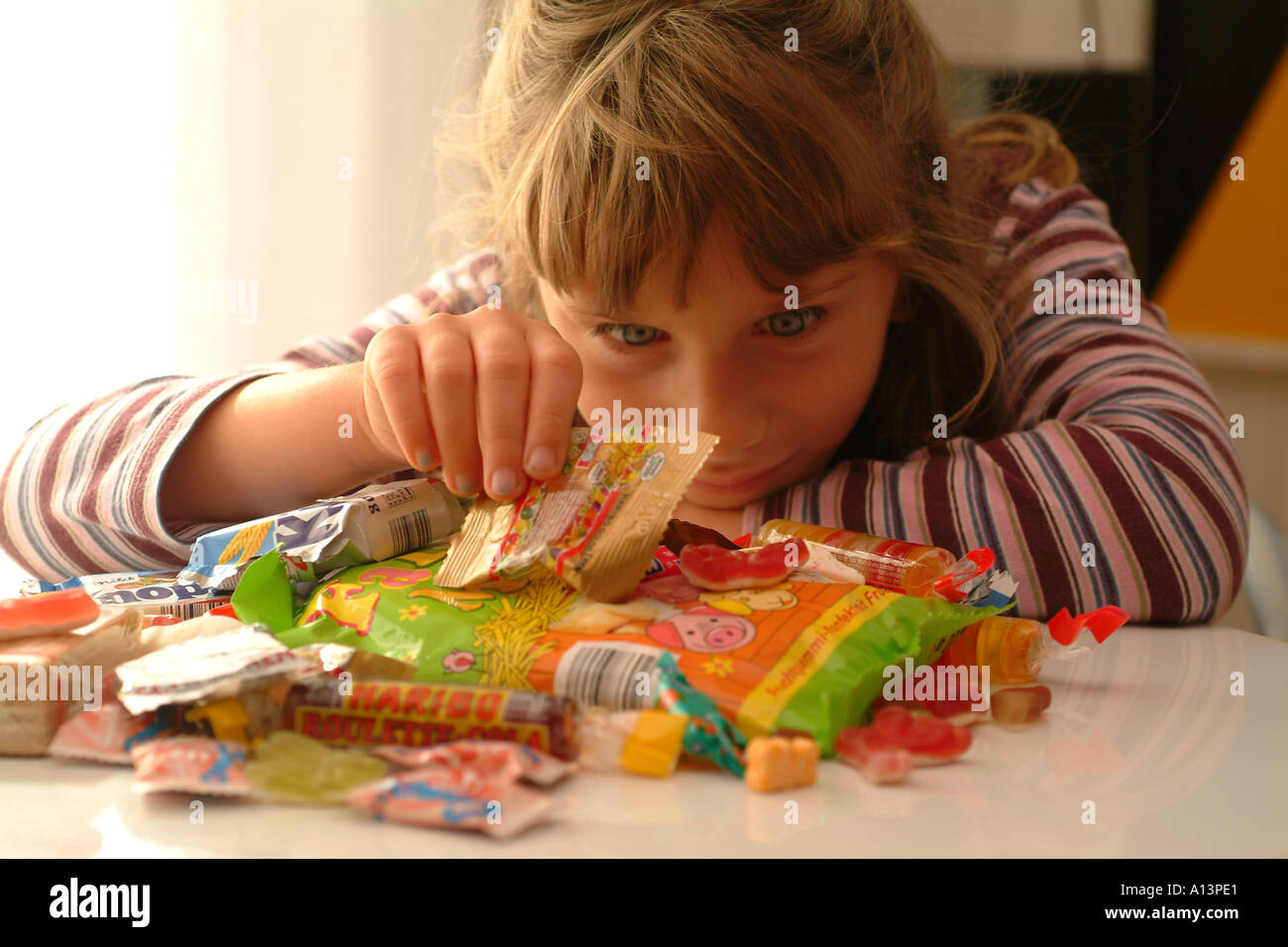 child eats sweets Stock Photo - Alamy