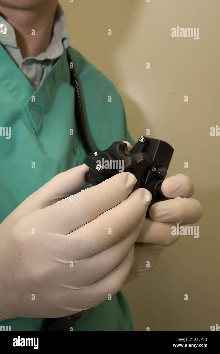 A doctor's hand operating an endoscope during an examination Stock ...