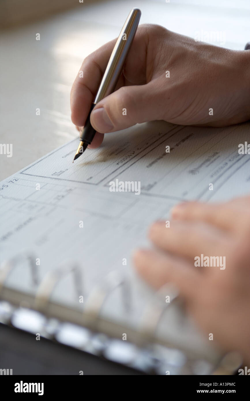 Writing a check hi-res stock photography and images - Alamy