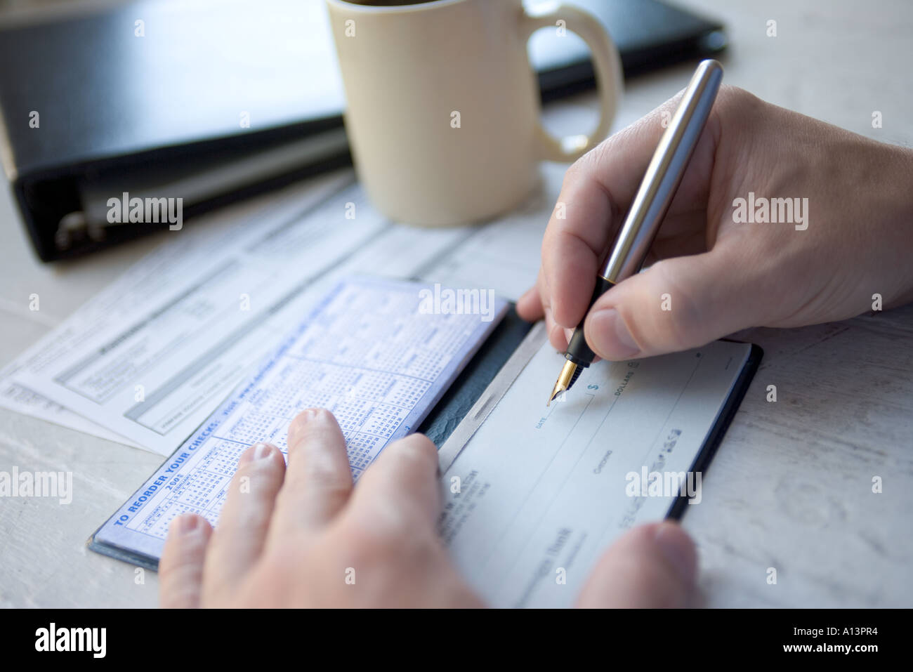 Writing a check Stock Photo - Alamy