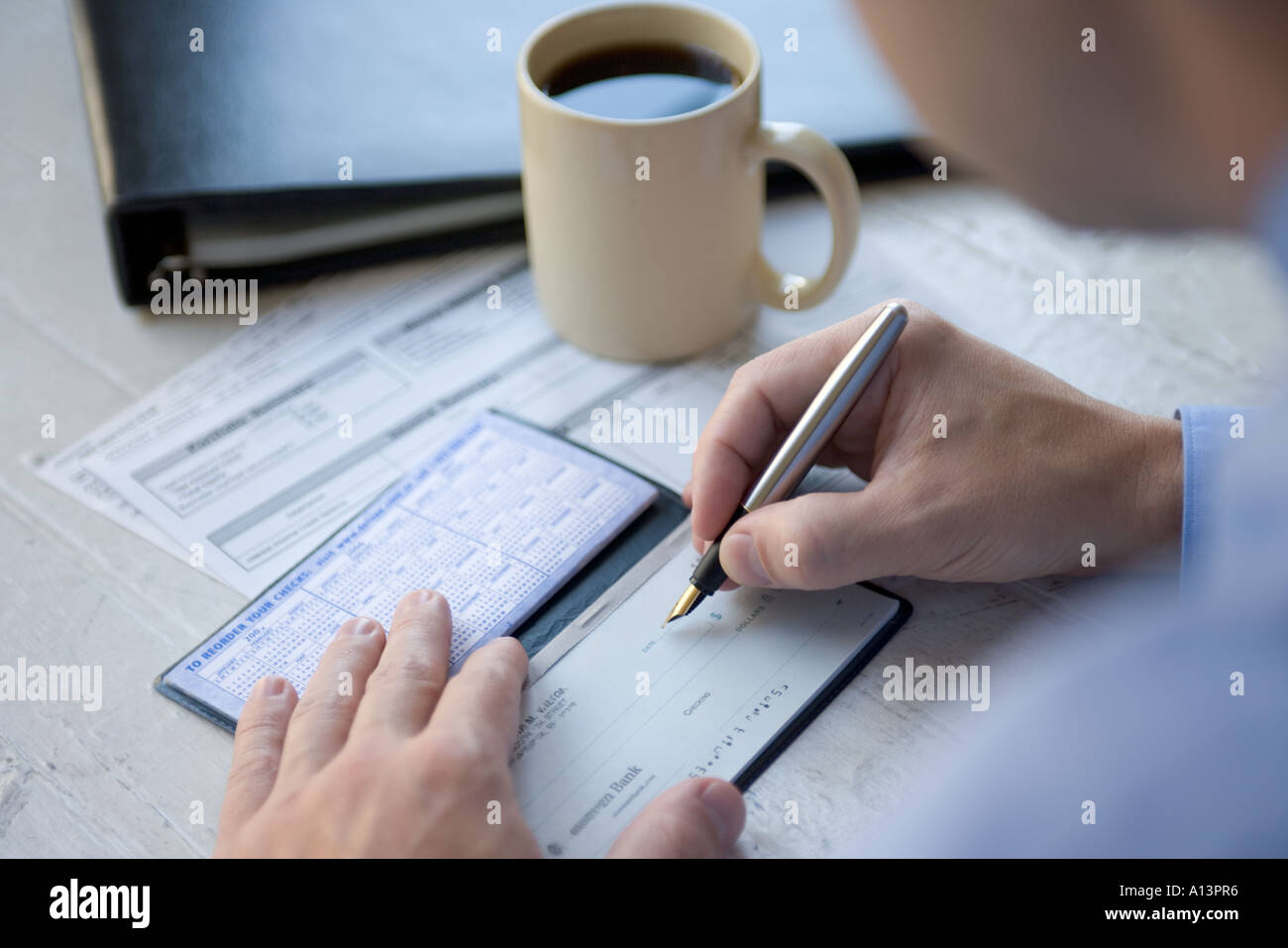 Writing a check Stock Photo - Alamy