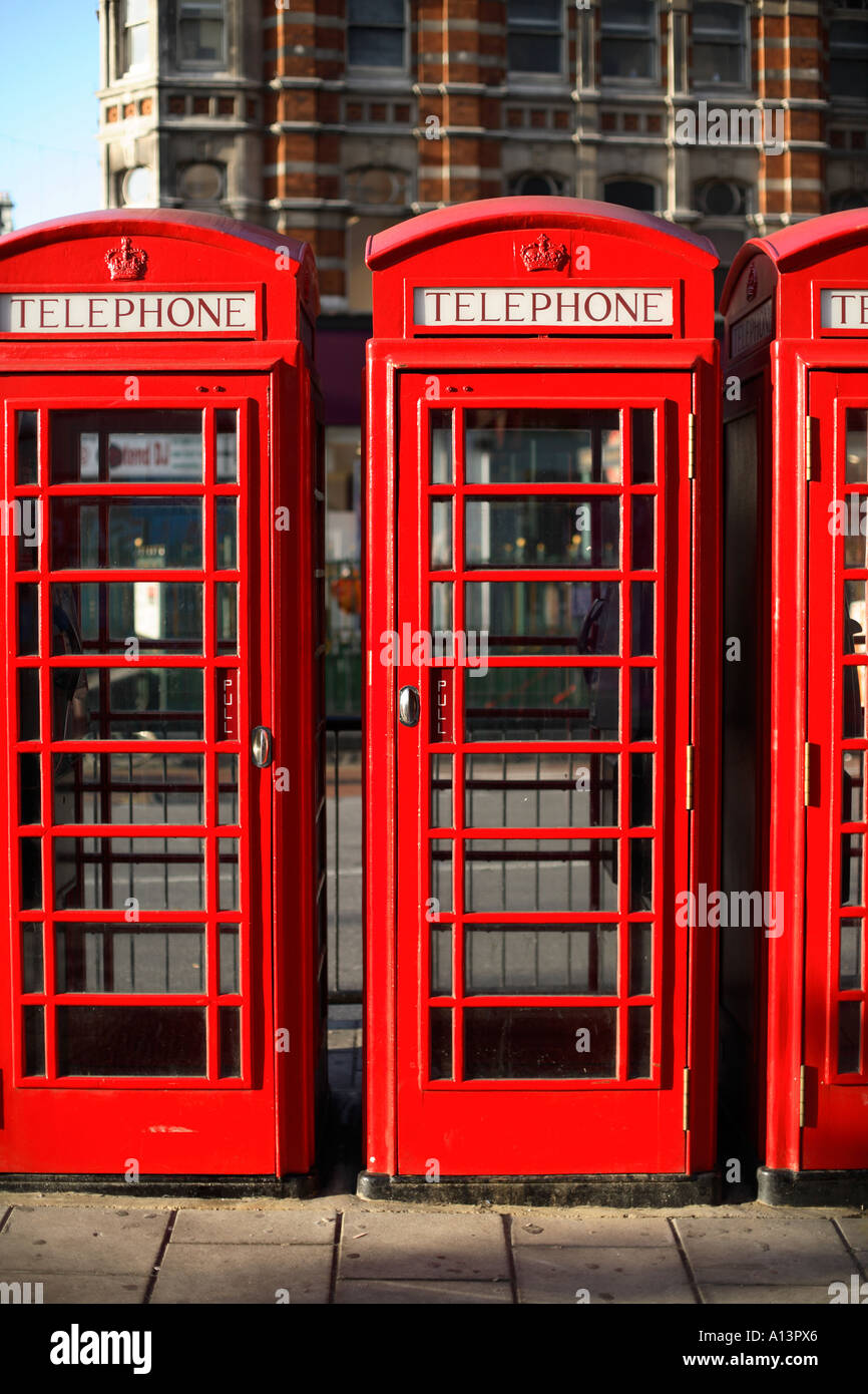 Red traditional telephone boxes on street corner in London, England, UK ...
