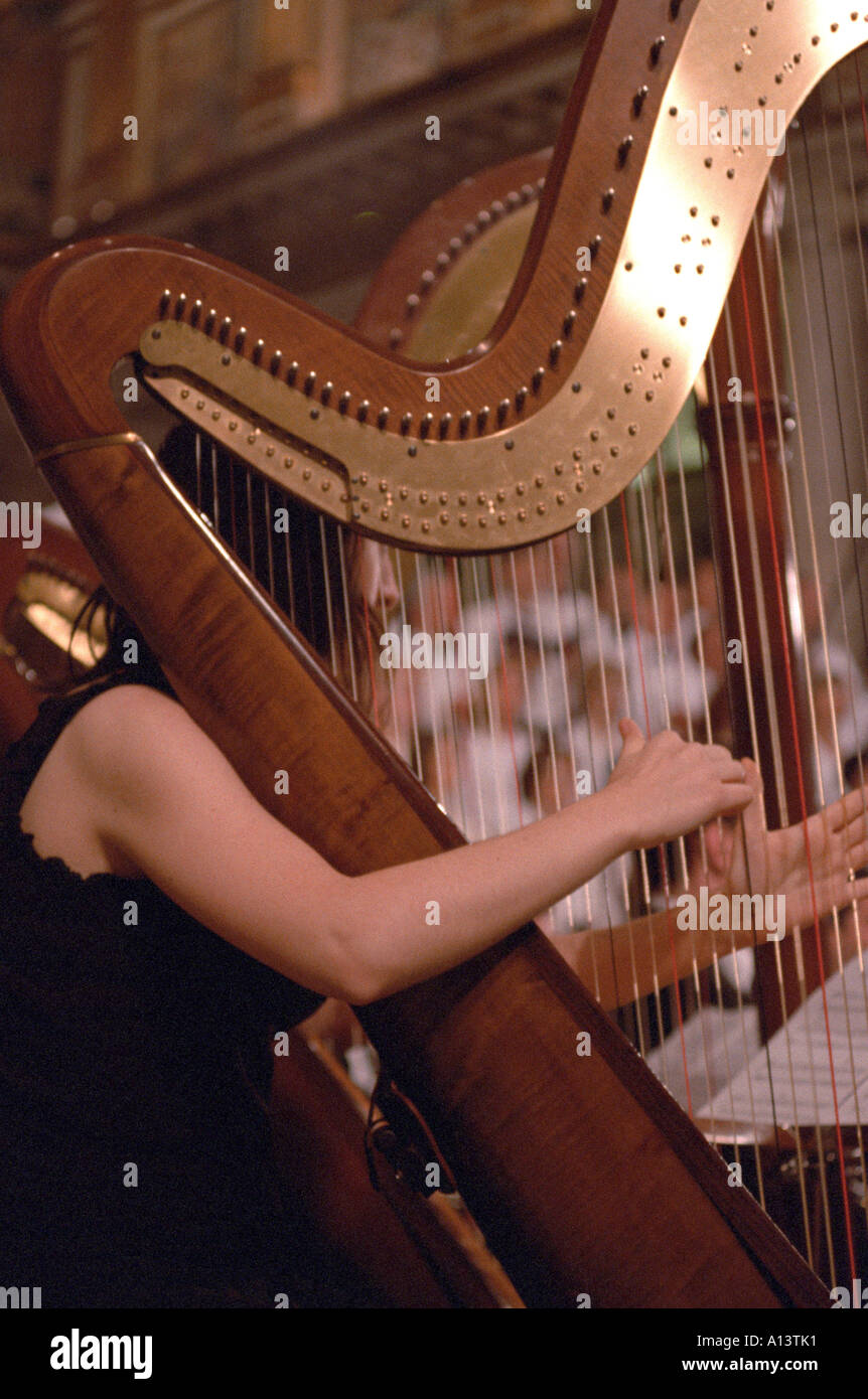 Girl playing harp hi-res stock photography and images - Alamy