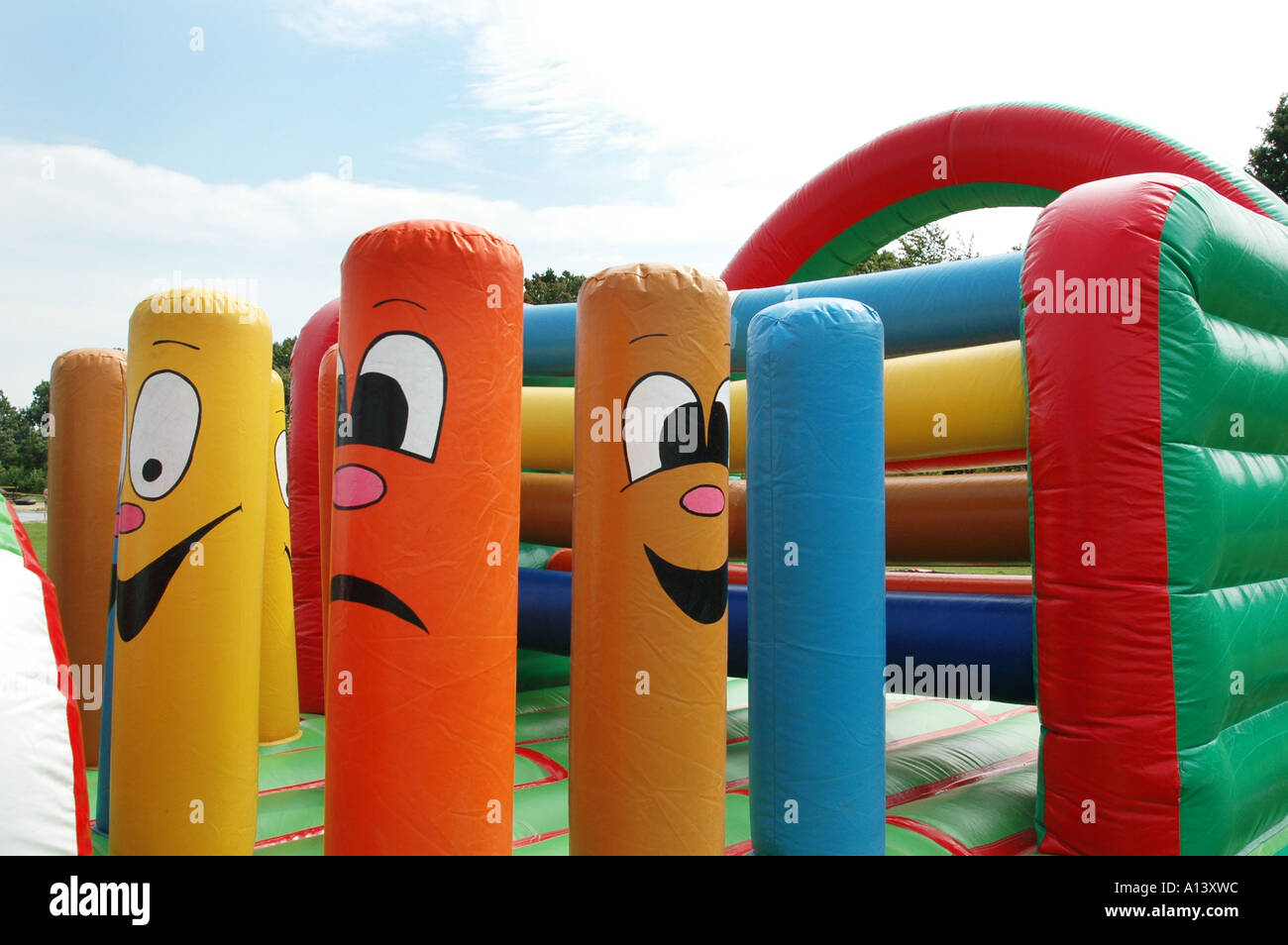 inflatable cones with faces at playground attraction Stock Photo - Alamy