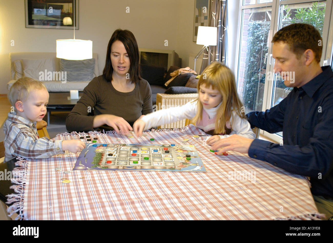Family plays board game hi-res stock photography and images - Alamy