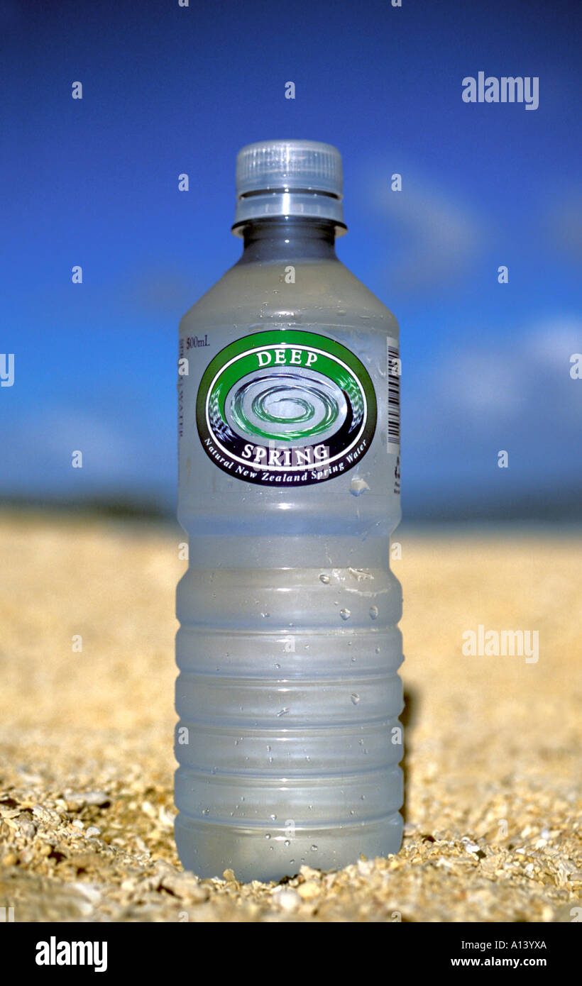 Bottled Deep Spring mineral water on a Cook Islands beach Stock Photo ...