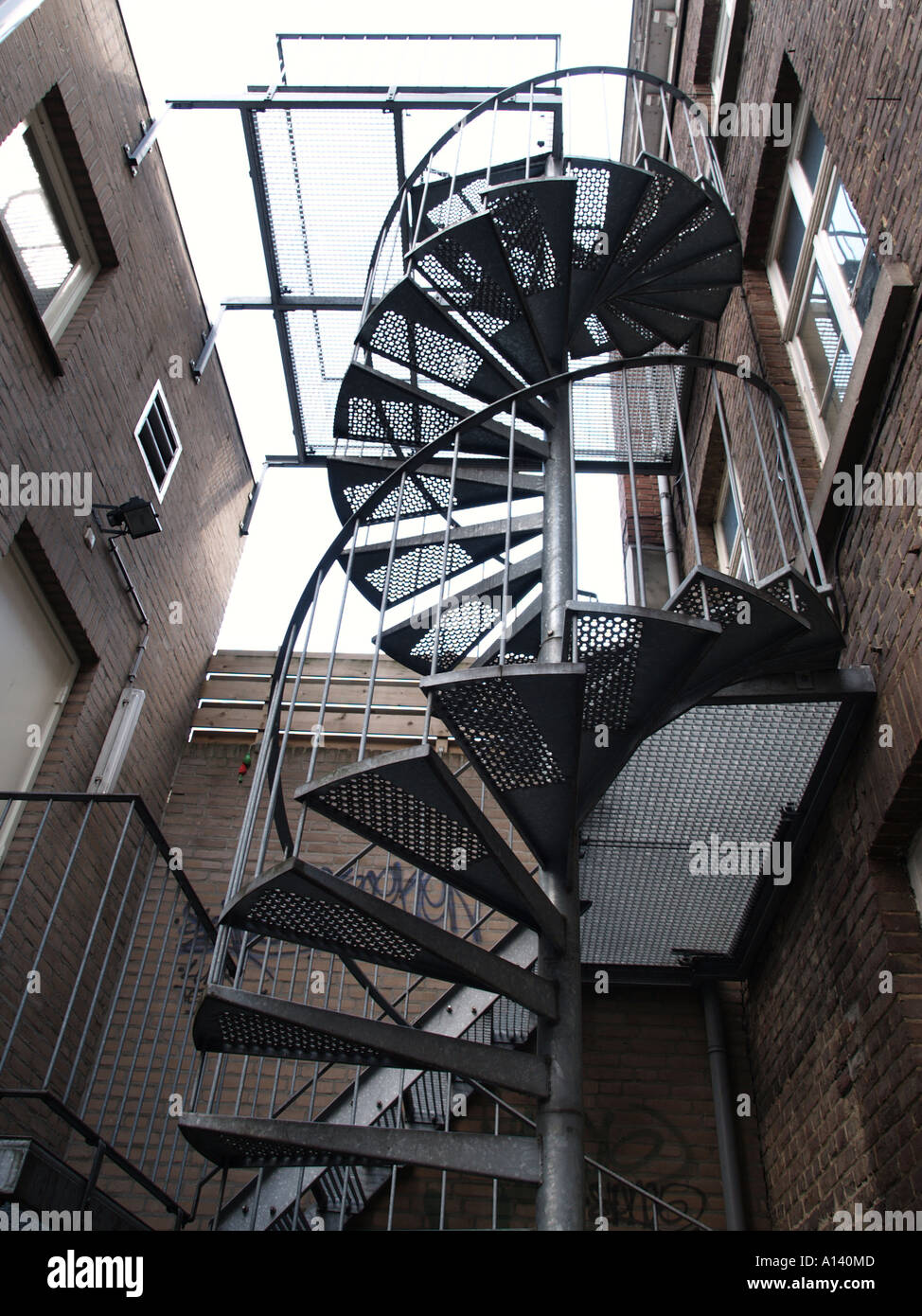 spiral staircase between buildings Stock Photo - Alamy