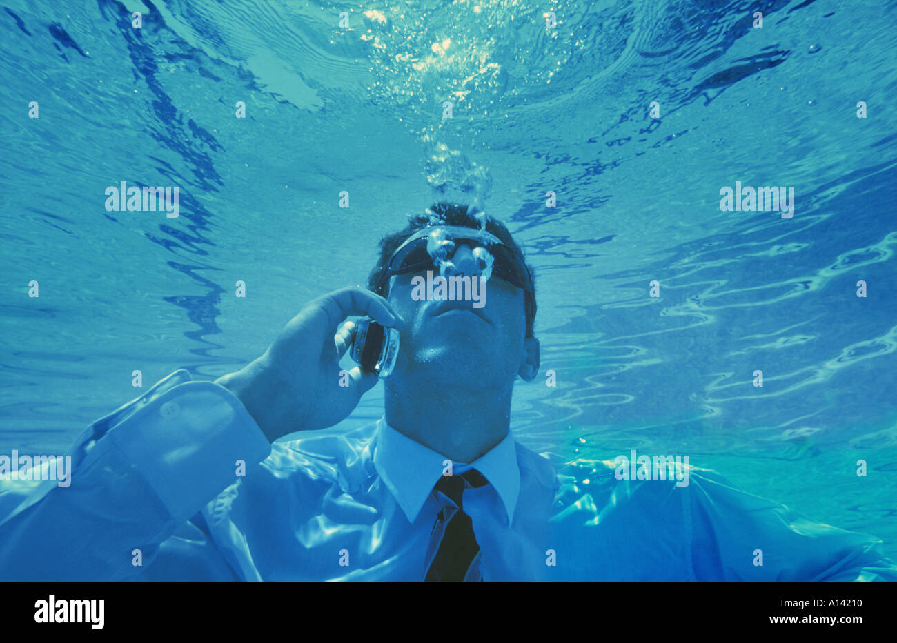 BUSINESSMAN WITH MOBILE PHONE CALLING ON UNDERWATER Stock Photo - Alamy