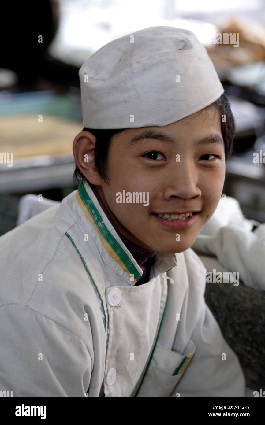 Boy working in a bakery in Beijing, China Stock Photo - Alamy