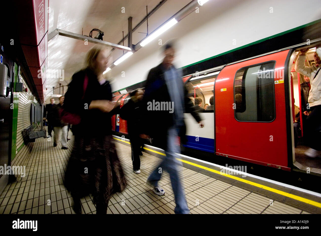 London underground tube network passengers commuters and tube train in ...