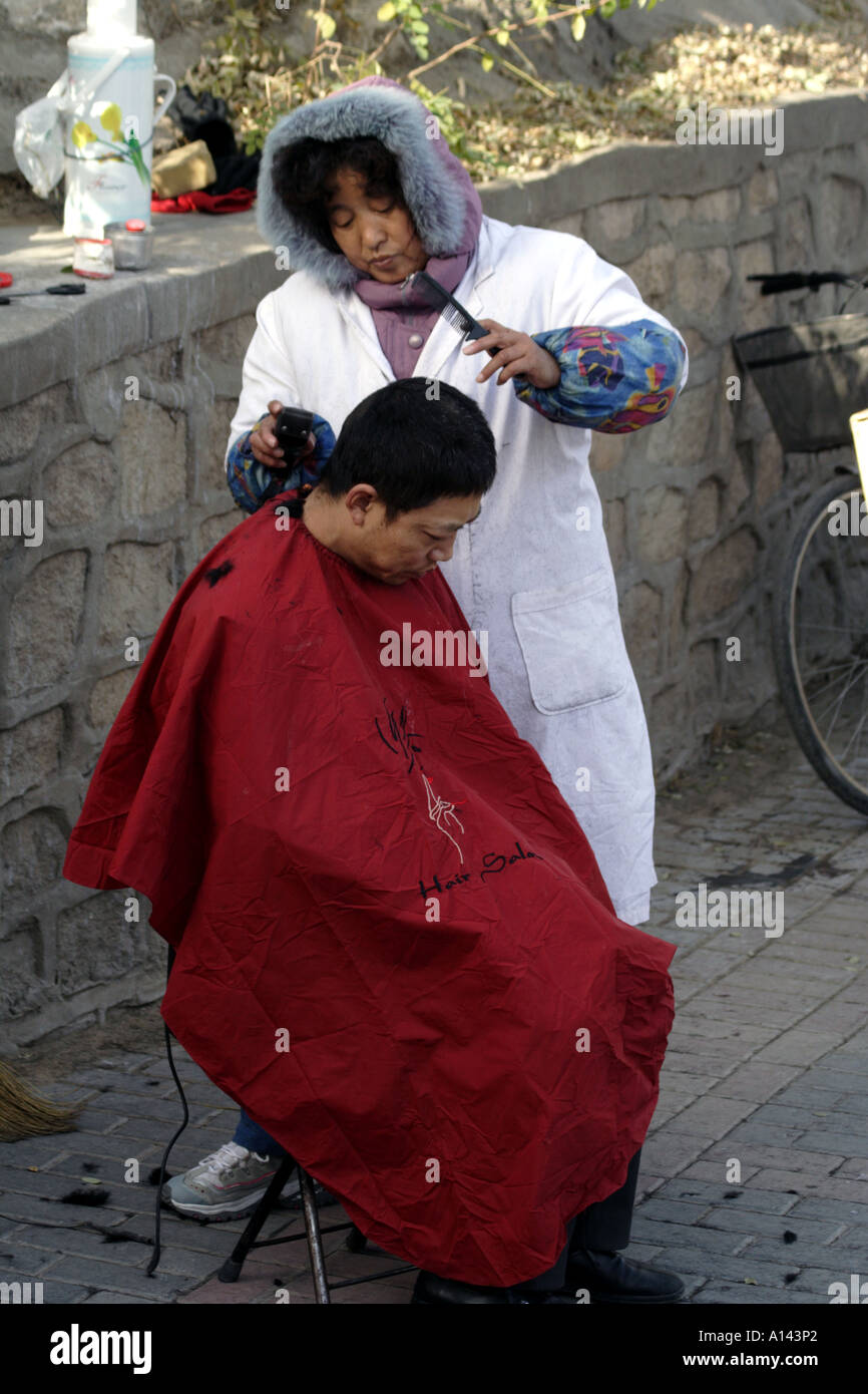 Outside barber cuts hair in Beijing, China Stock Photo - Alamy