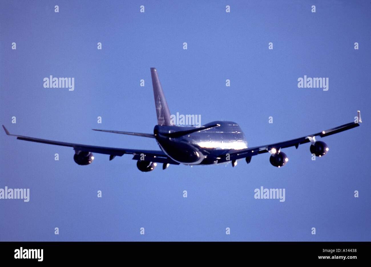 Boeing 747 aircraft against clear blue sky Stock Photo - Alamy