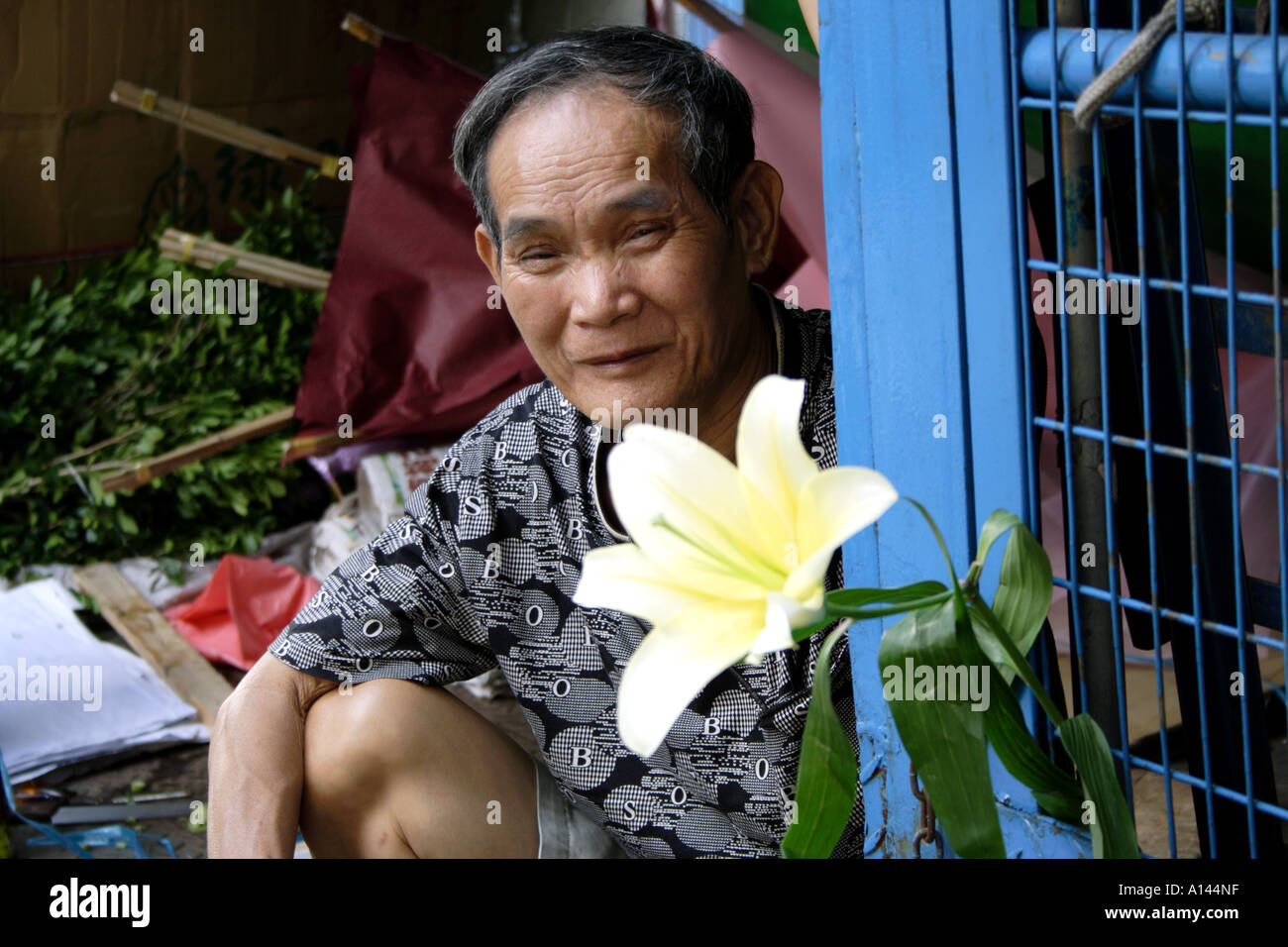 Old man at the Kowloon flower market, Kowloon, Hong Kong, SAR Stock ...