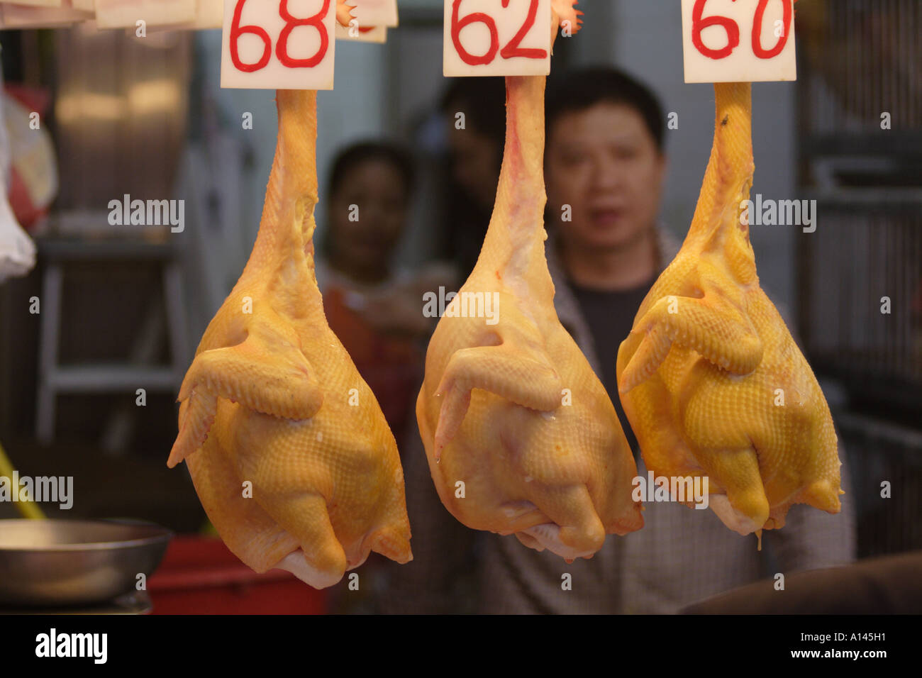 Hanging chickens hi-res stock photography and images - Alamy
