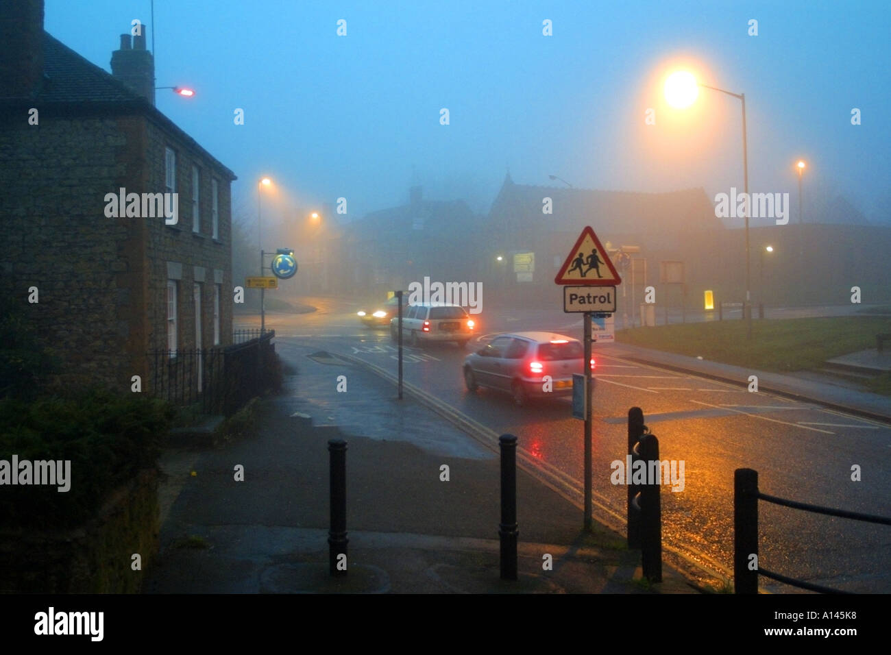Foggy evening street scene in small rural town Faringdon Oxfordshire ...