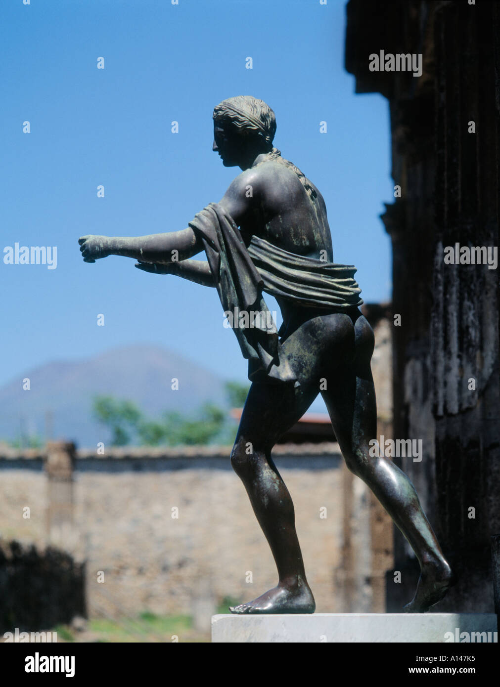 Pompeii, Italy. Visitor admiring statue of Apollo the Archer in ...