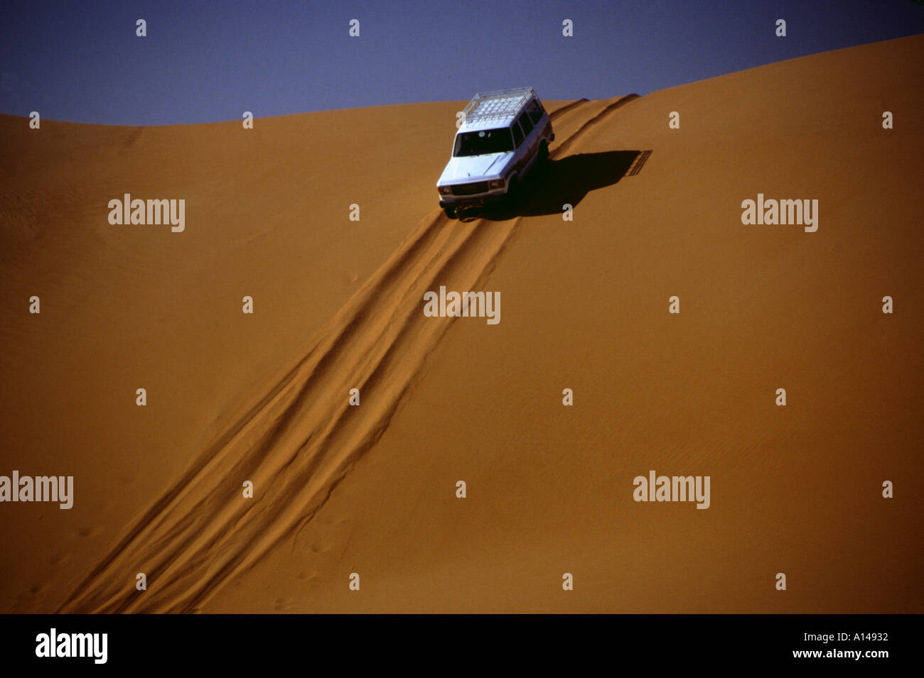 Libya desert Sahara jeep on a desert road Stock Photo - Alamy