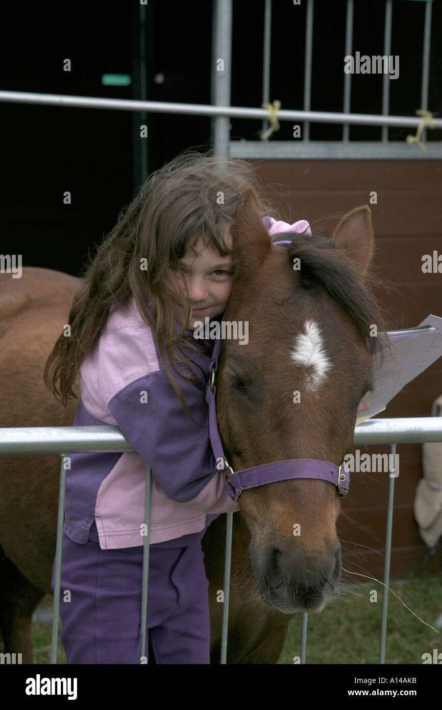 Girl hugging pony hi-res stock photography and images - Alamy