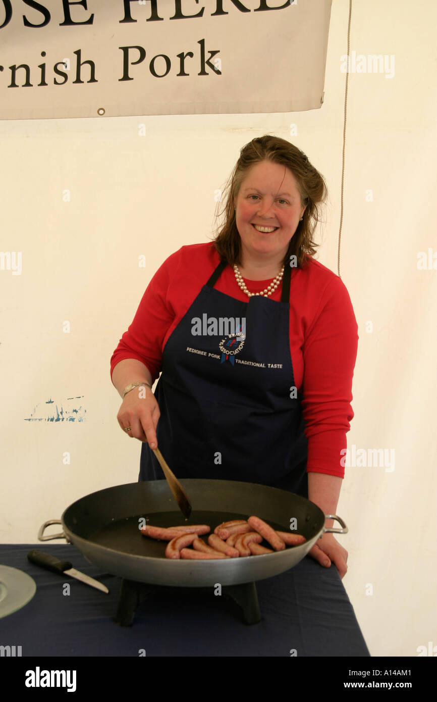 Woman cooking Cornish pork sausages at Devon County Show Stock Photo ...