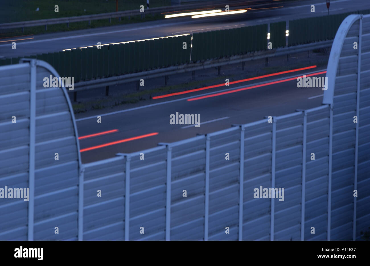 noise protection wall at highway, blue hour Stock Photo - Alamy