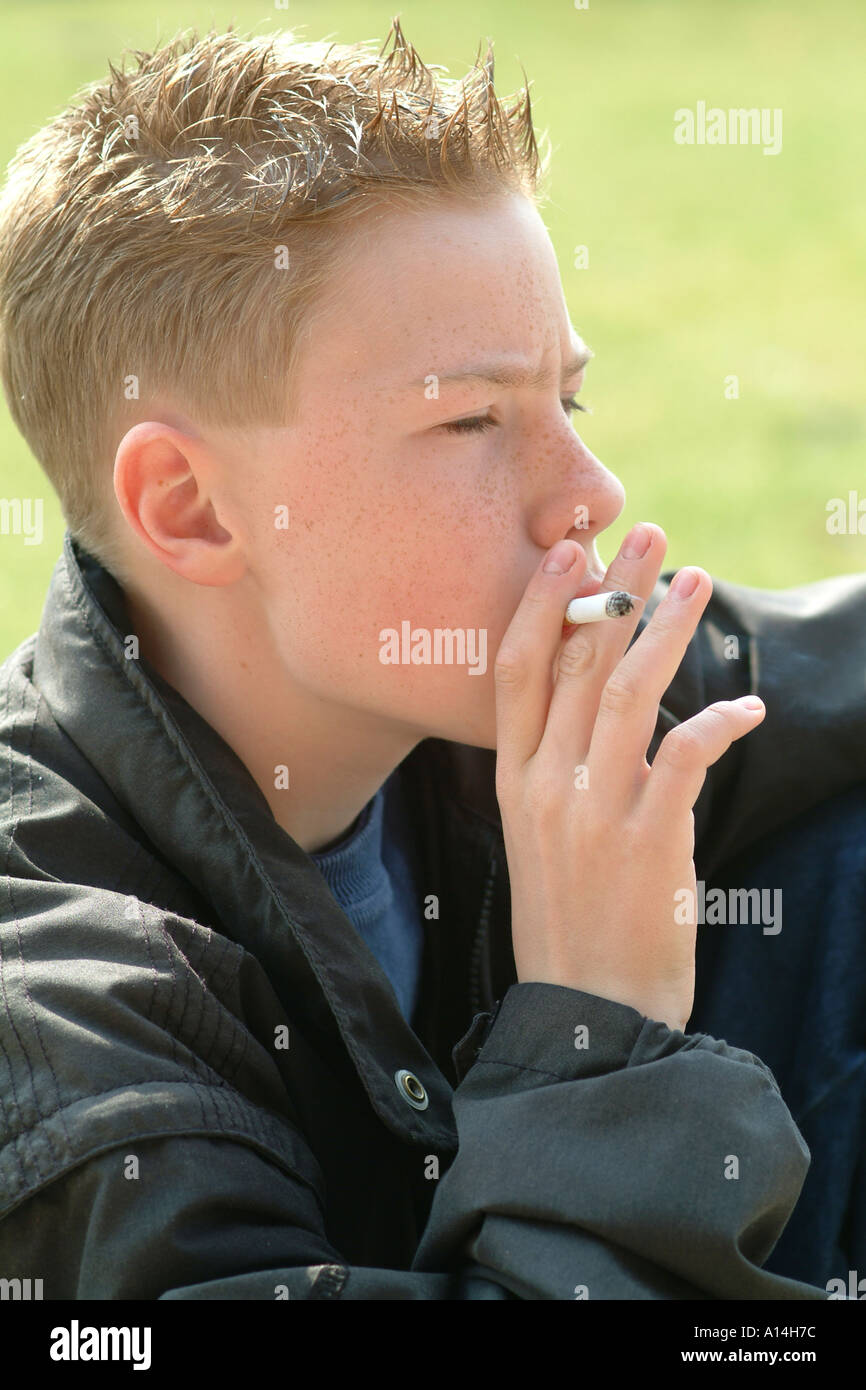 teenager smokes a cigarette Stock Photo - Alamy
