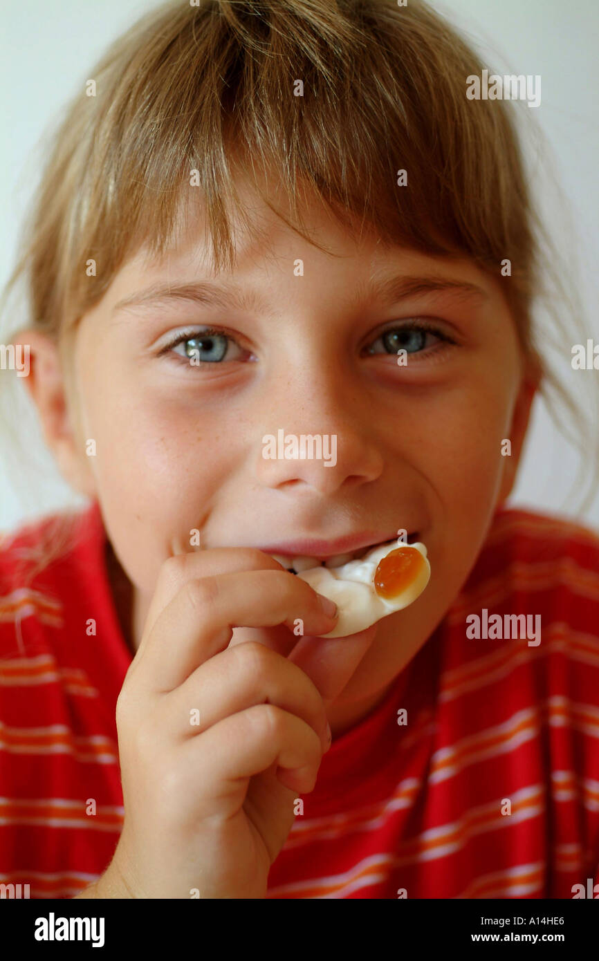 child eats sweets Stock Photo - Alamy
