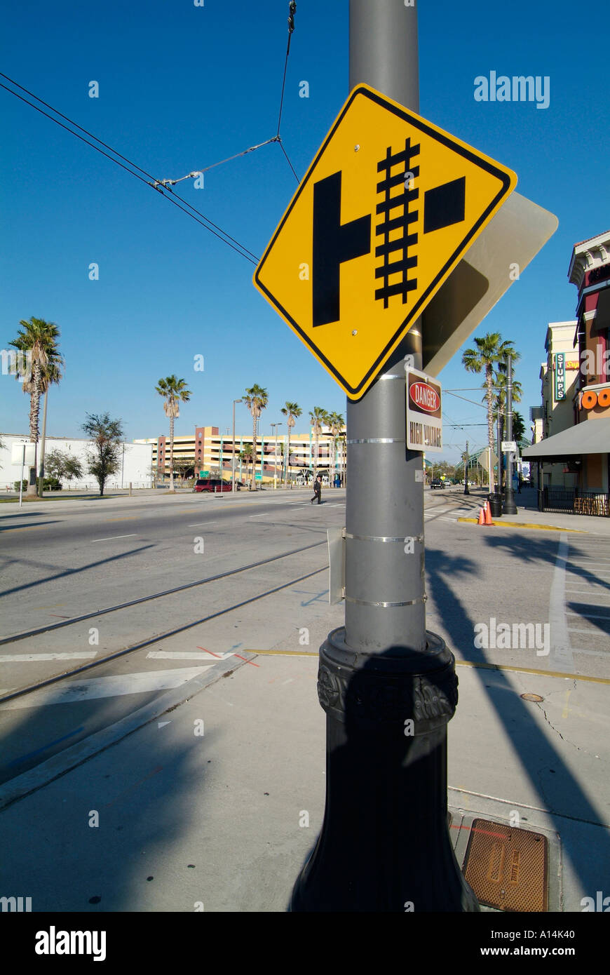Sign showing a cross street and railroad track for trolley in downtown ...