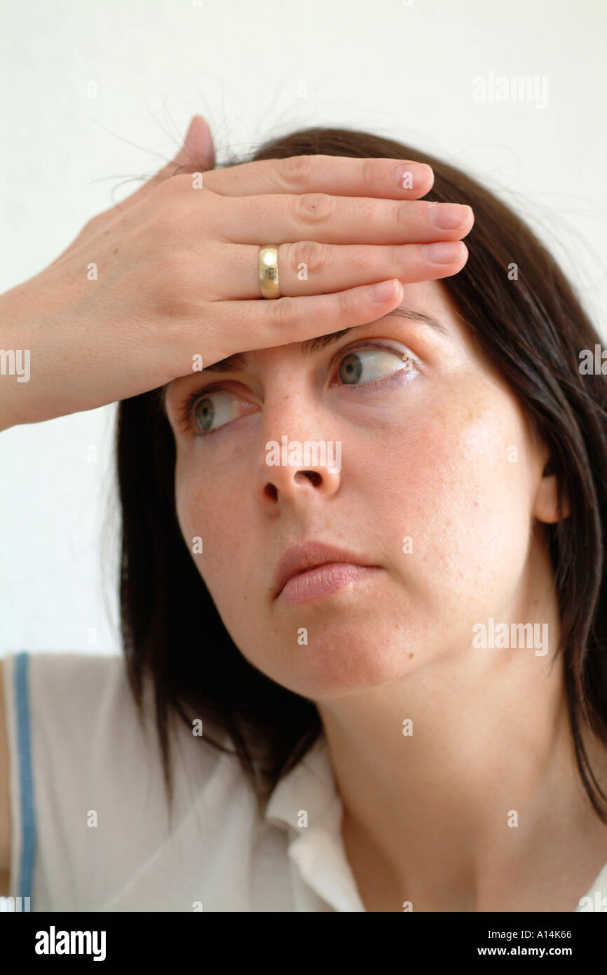 woman has a slight headache Stock Photo - Alamy