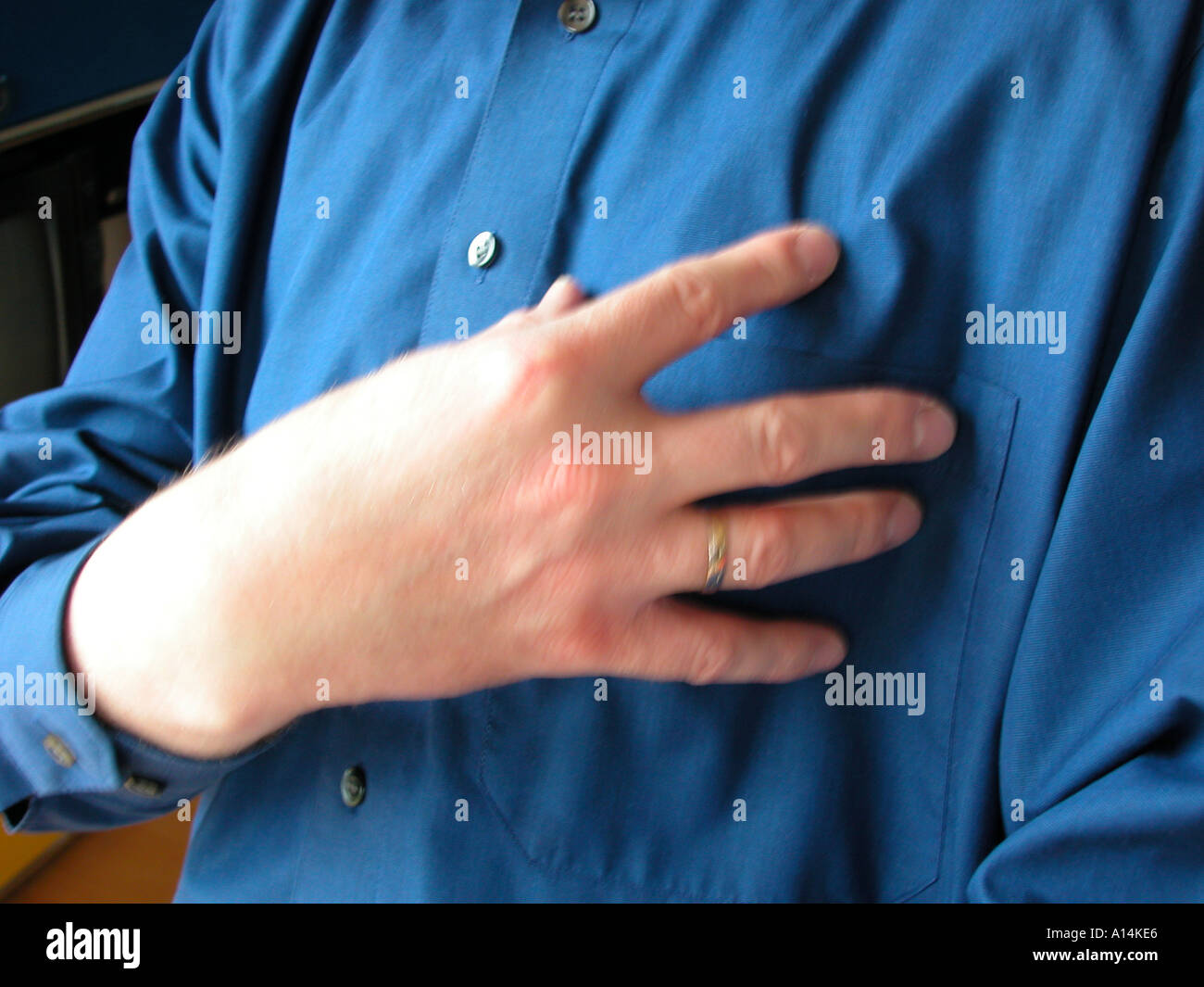 man takes his hand on his heart Stock Photo - Alamy