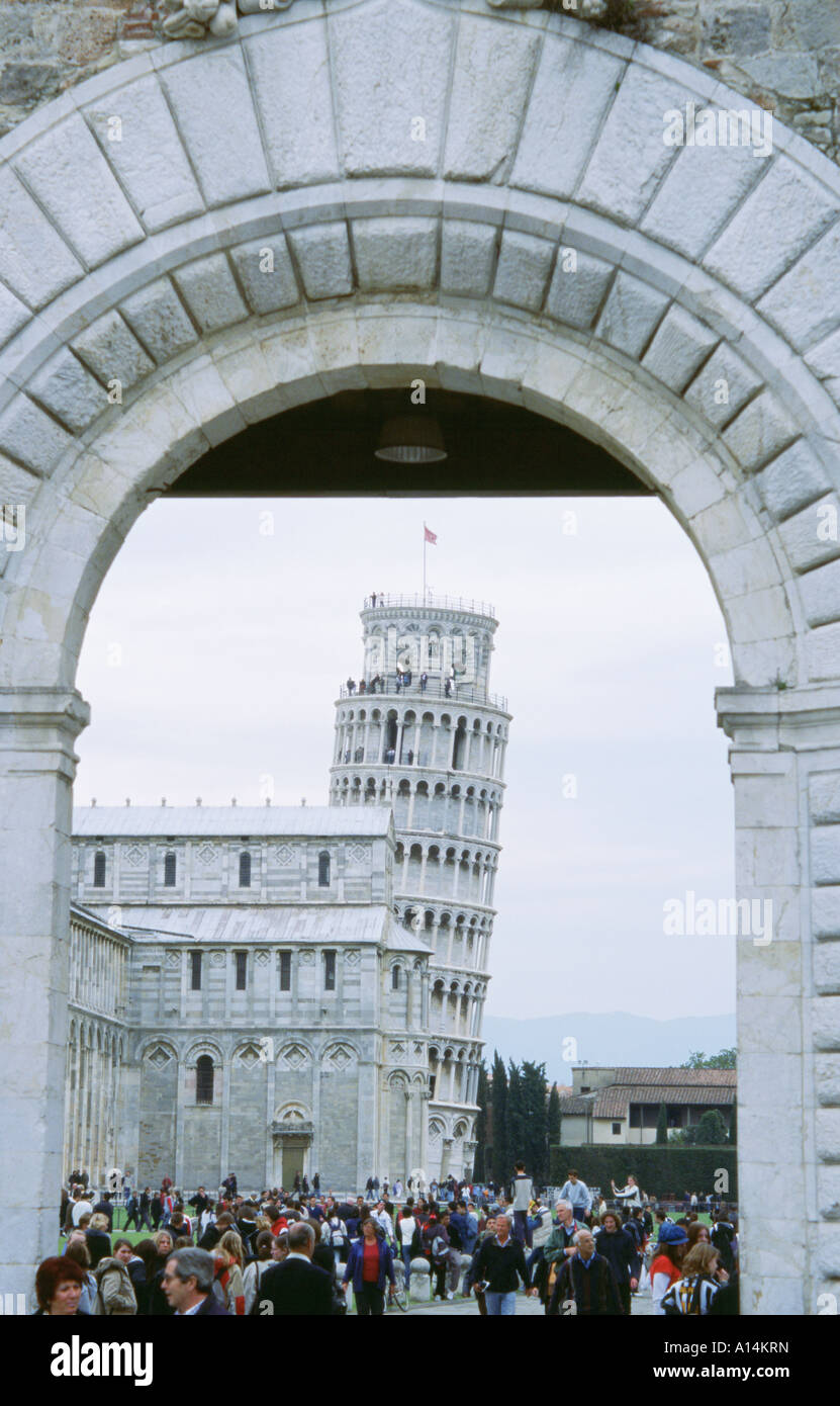 View of the Leaning Tower of Pisa and crowd of people through archway ...