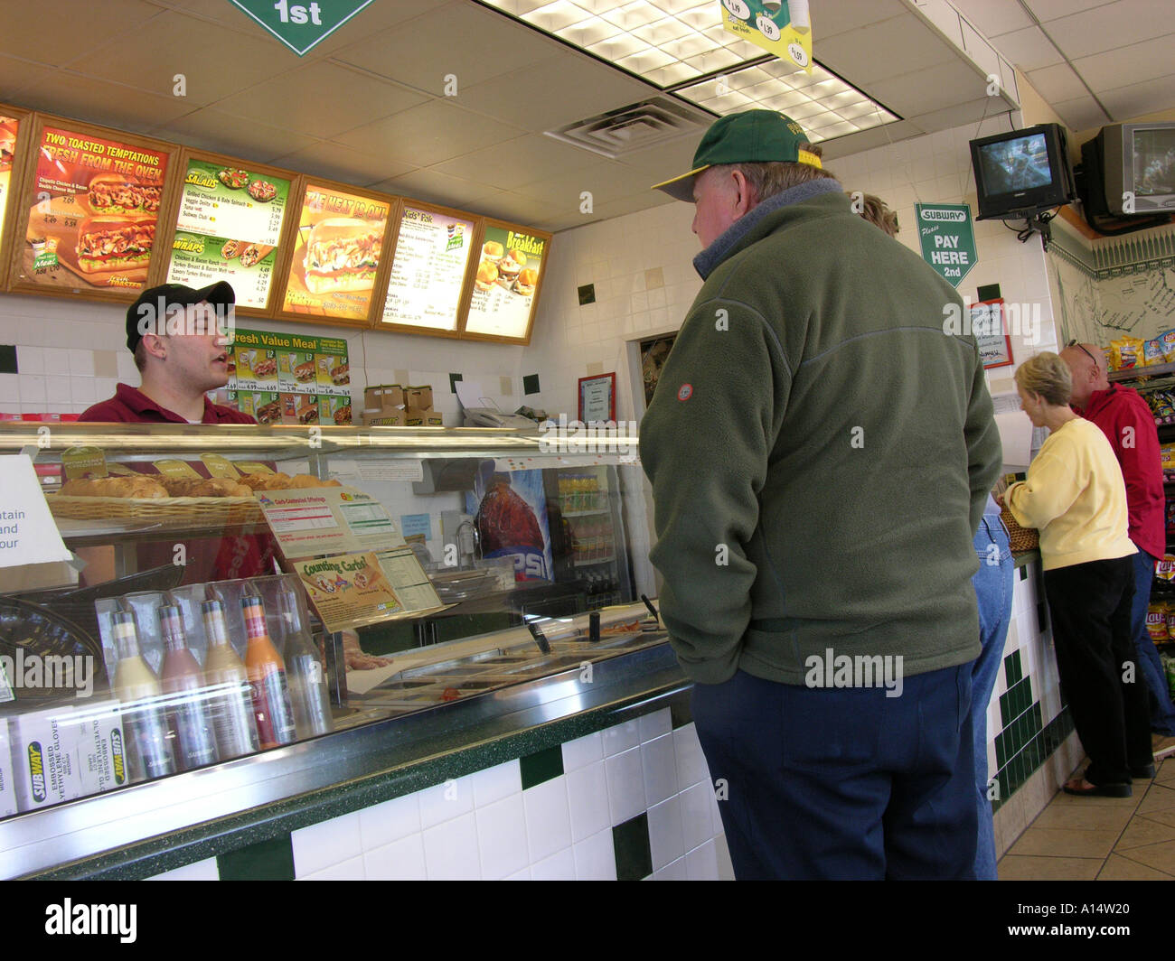 Patrons order food from a fast food chain Stock Photo - Alamy