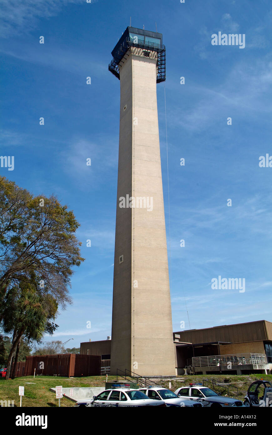 Air traffic control tower controls the take off and landings of jet ...