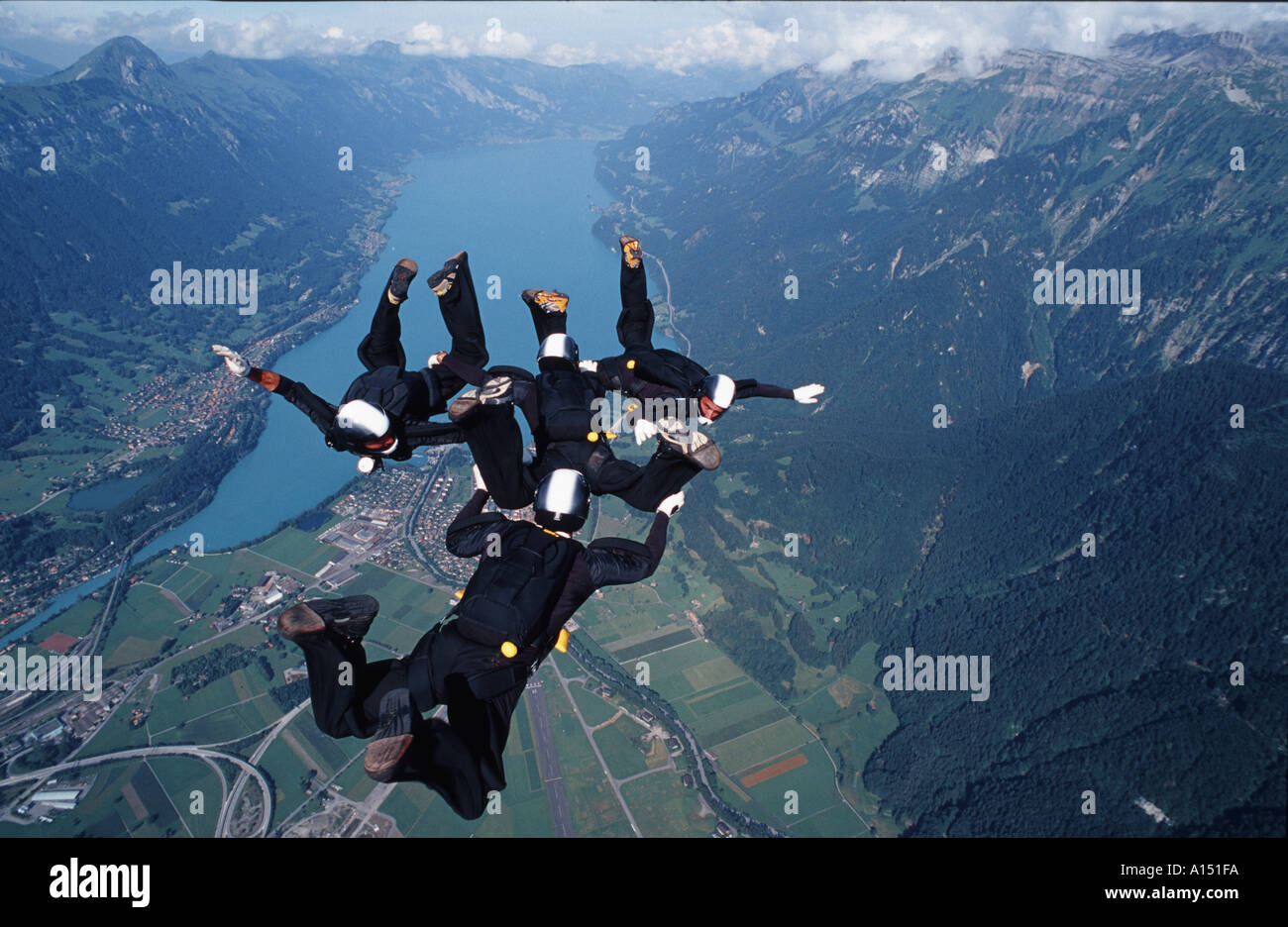 Freefall Team over Interlaken In the background Lake Brienz Stock Photo ...