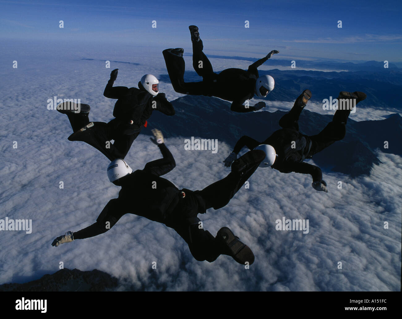 Zebra Freefall Team during training above a beautiful cloud layer Stock ...
