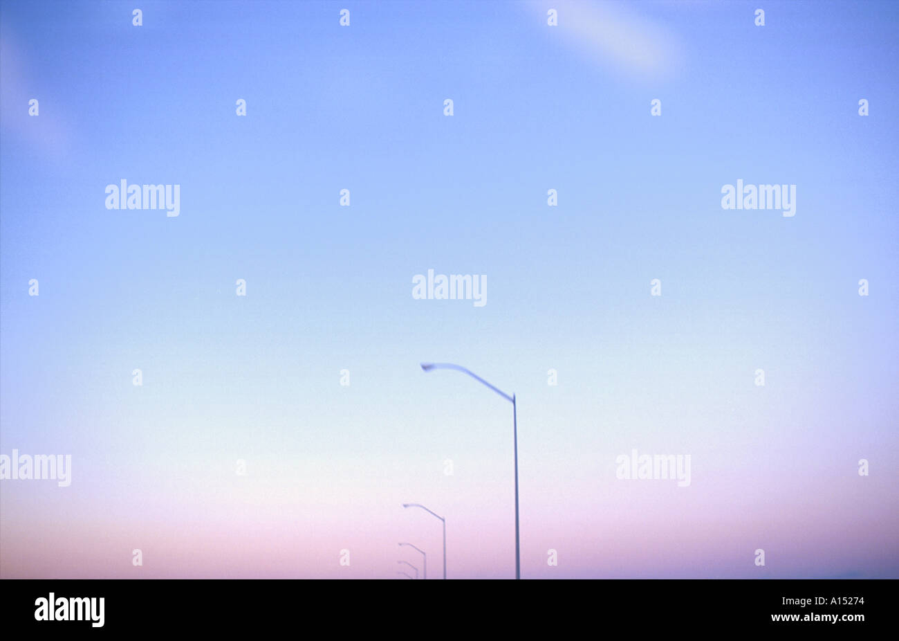 receding line of highway lamps Stock Photo - Alamy