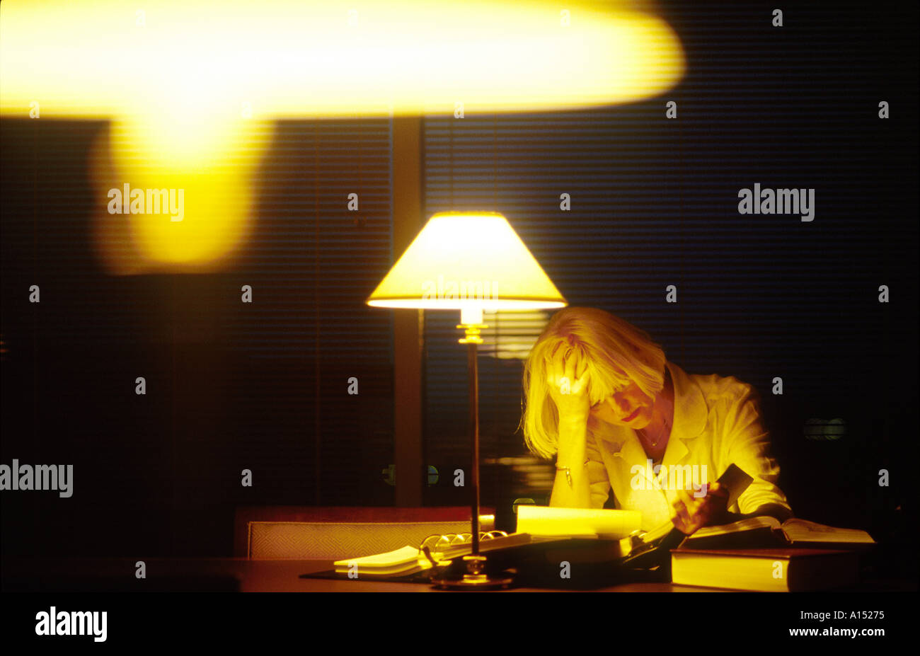 woman studying by lamplight Stock Photo - Alamy