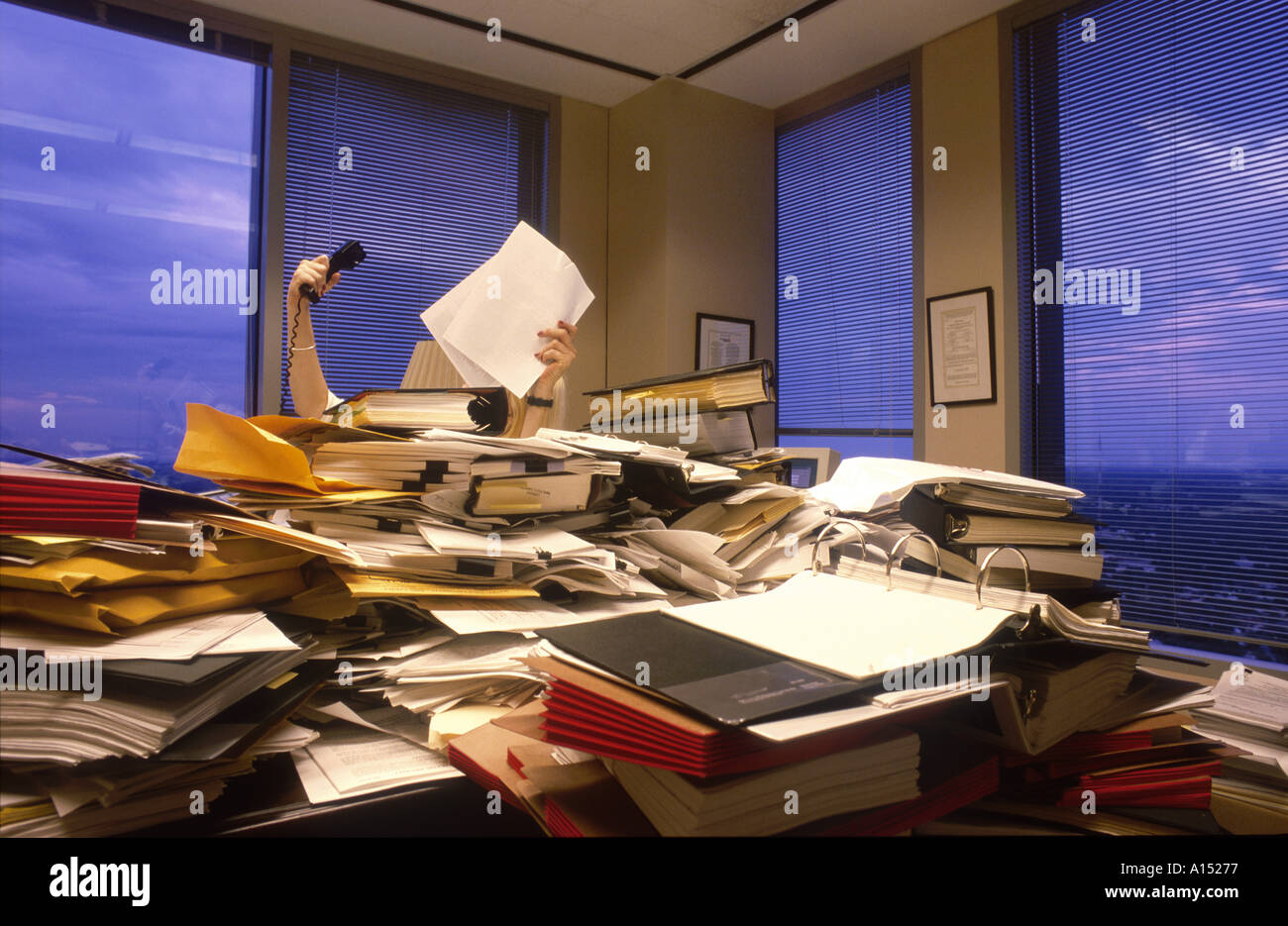 Hidden behind paperwork hi-res stock photography and images - Alamy
